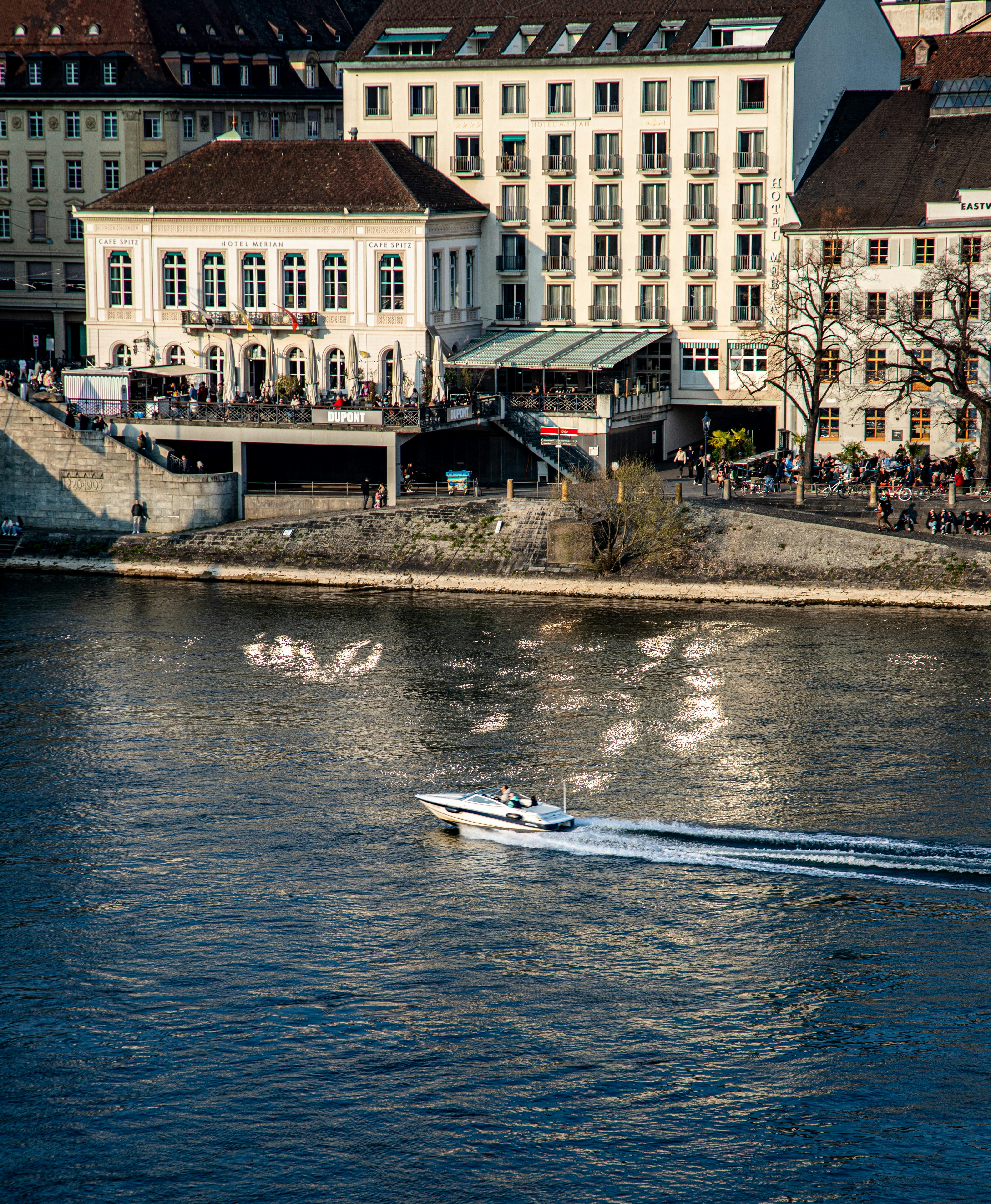 Riverside Atrium: Boats Skim the Spree Before a Historic Waterfront
