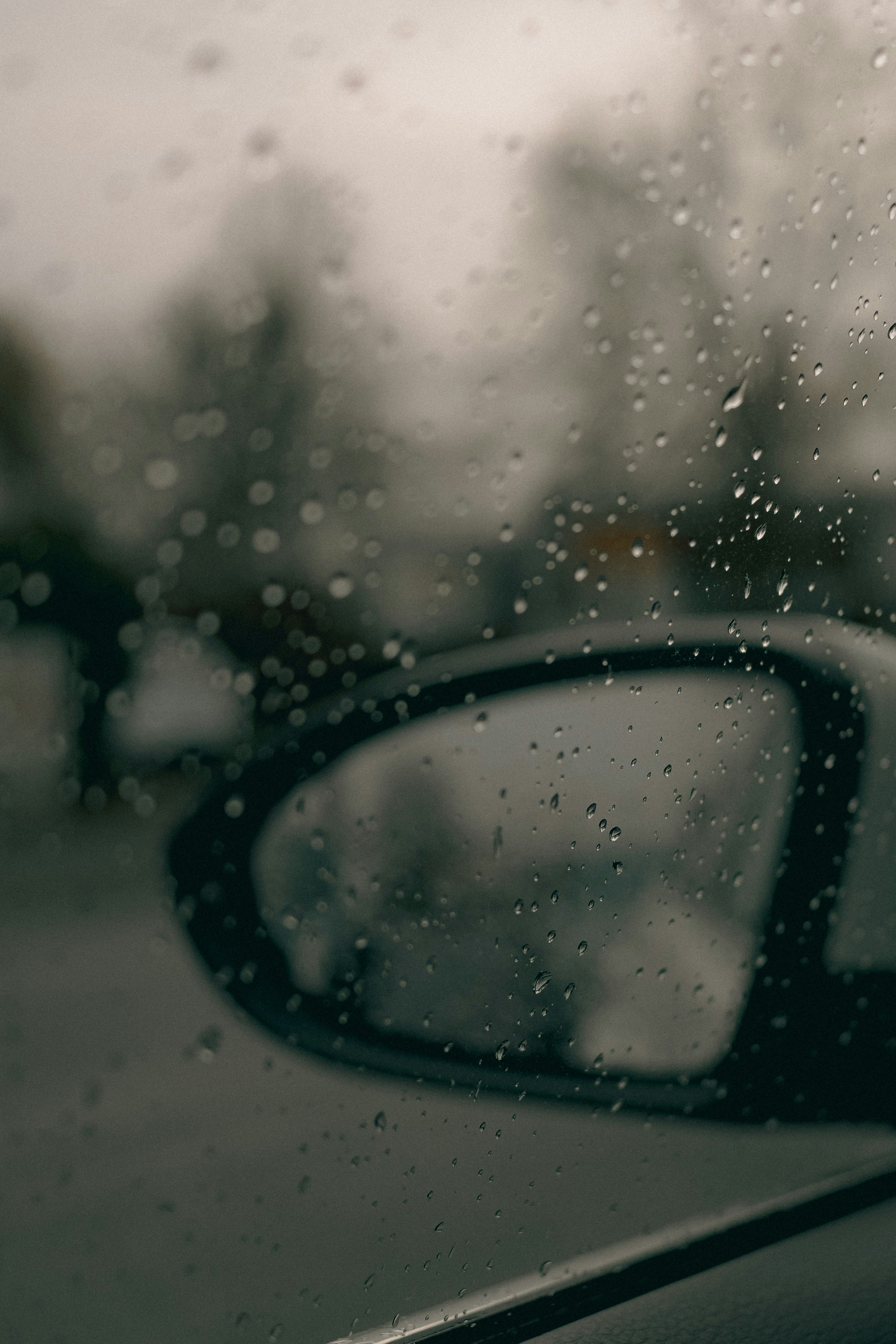 Raindrops on the Car Window: A Quiet, Blur-Soaked View