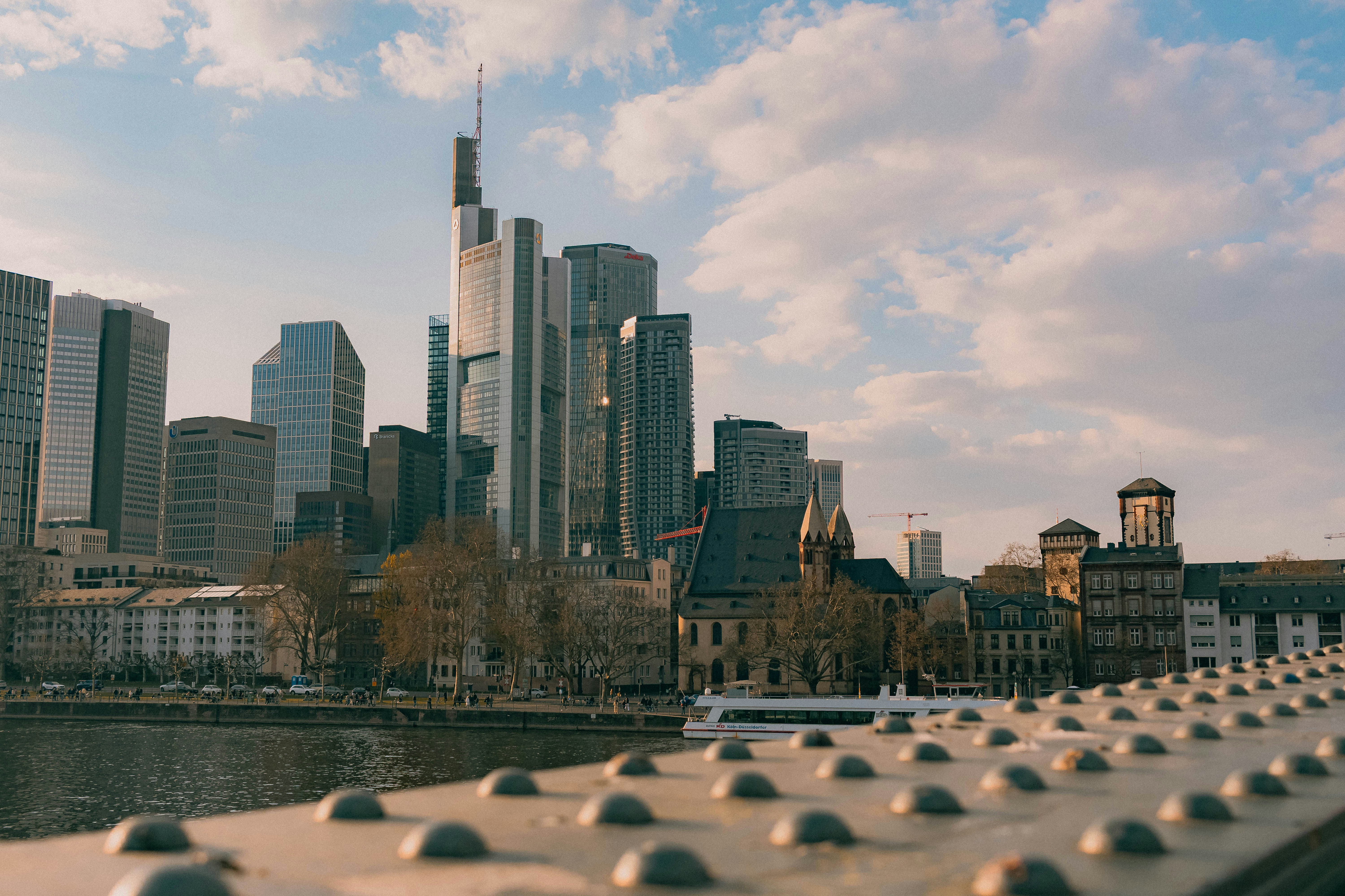 Urban Horizons: Glass Skyscrapers Rise Over a Quiet Riverside