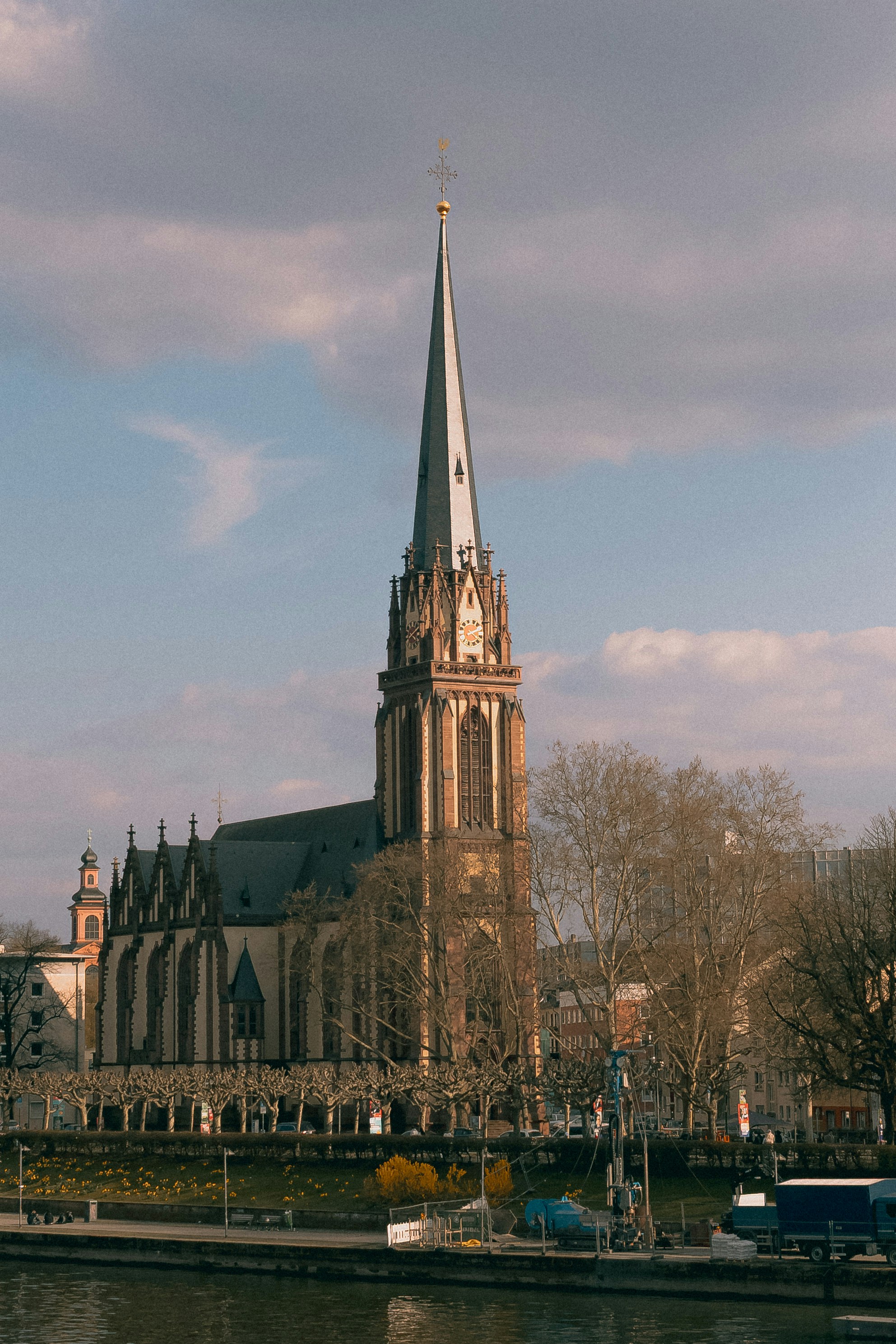 Saintly Spire: Cathedral Heads Skyward Over Riverside Park