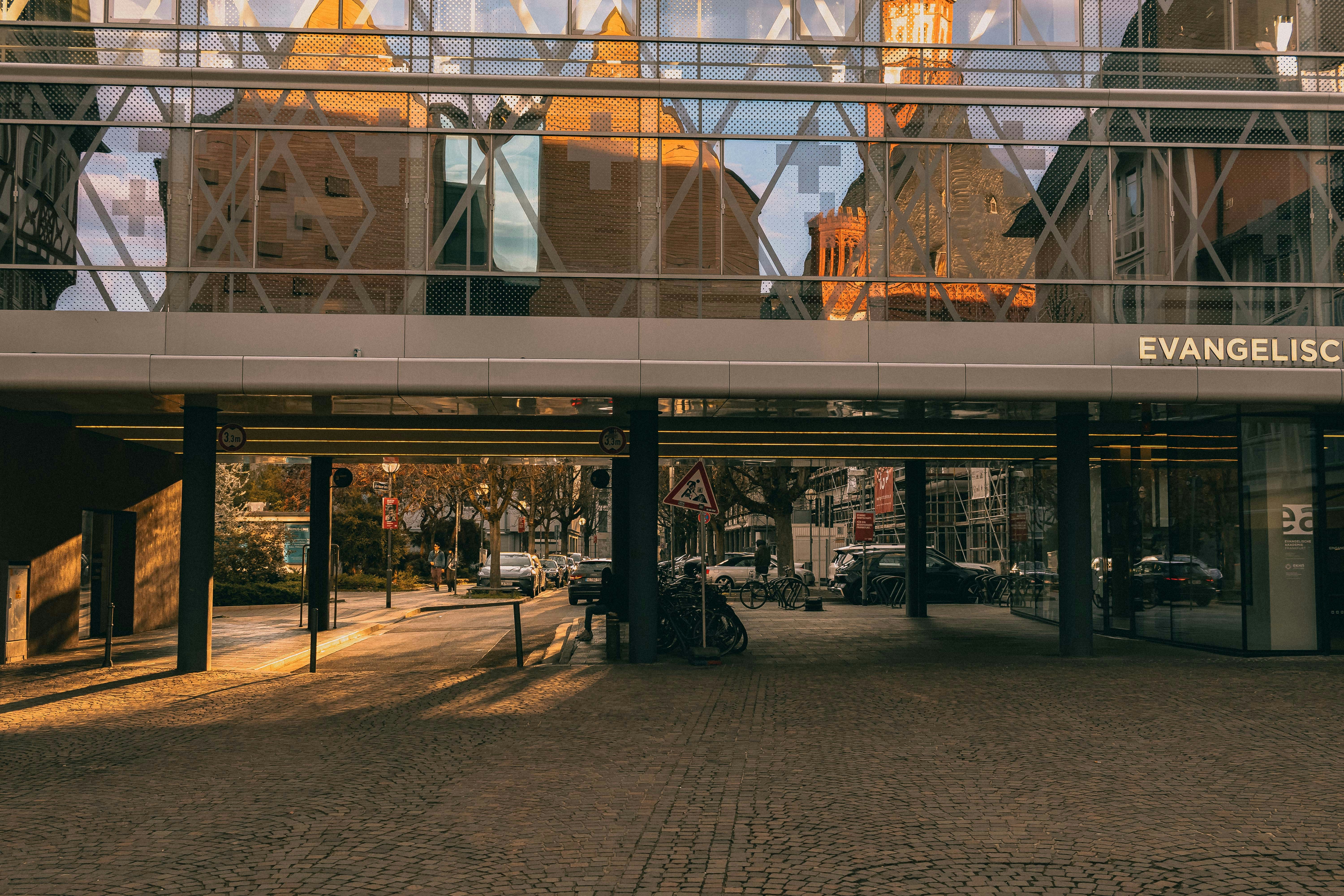 Glass Facade Echoes: City Entrance Under a Tangle of Reflections