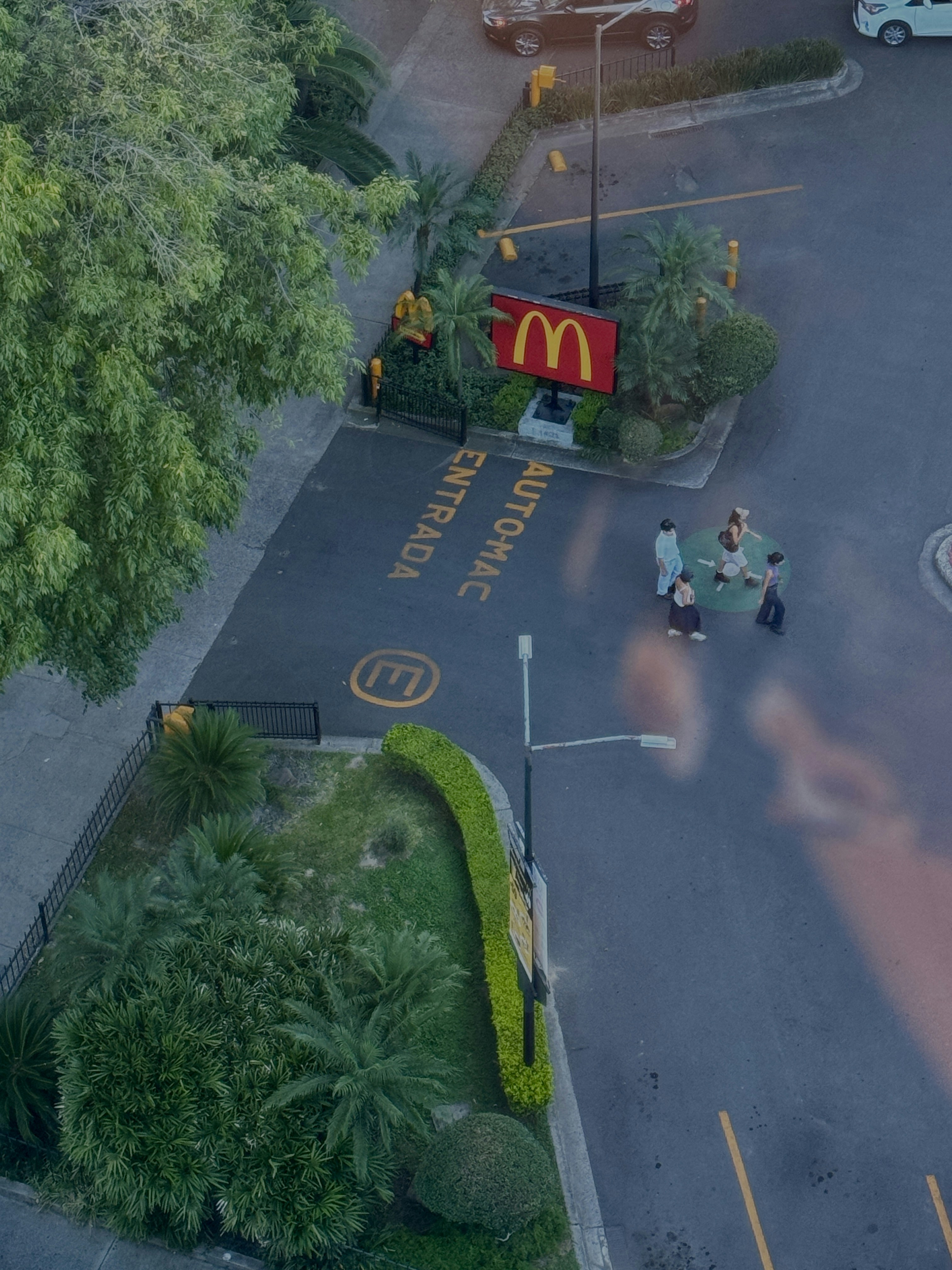 Aerial View of a McDonald's Parking Entrance and Group of Guests