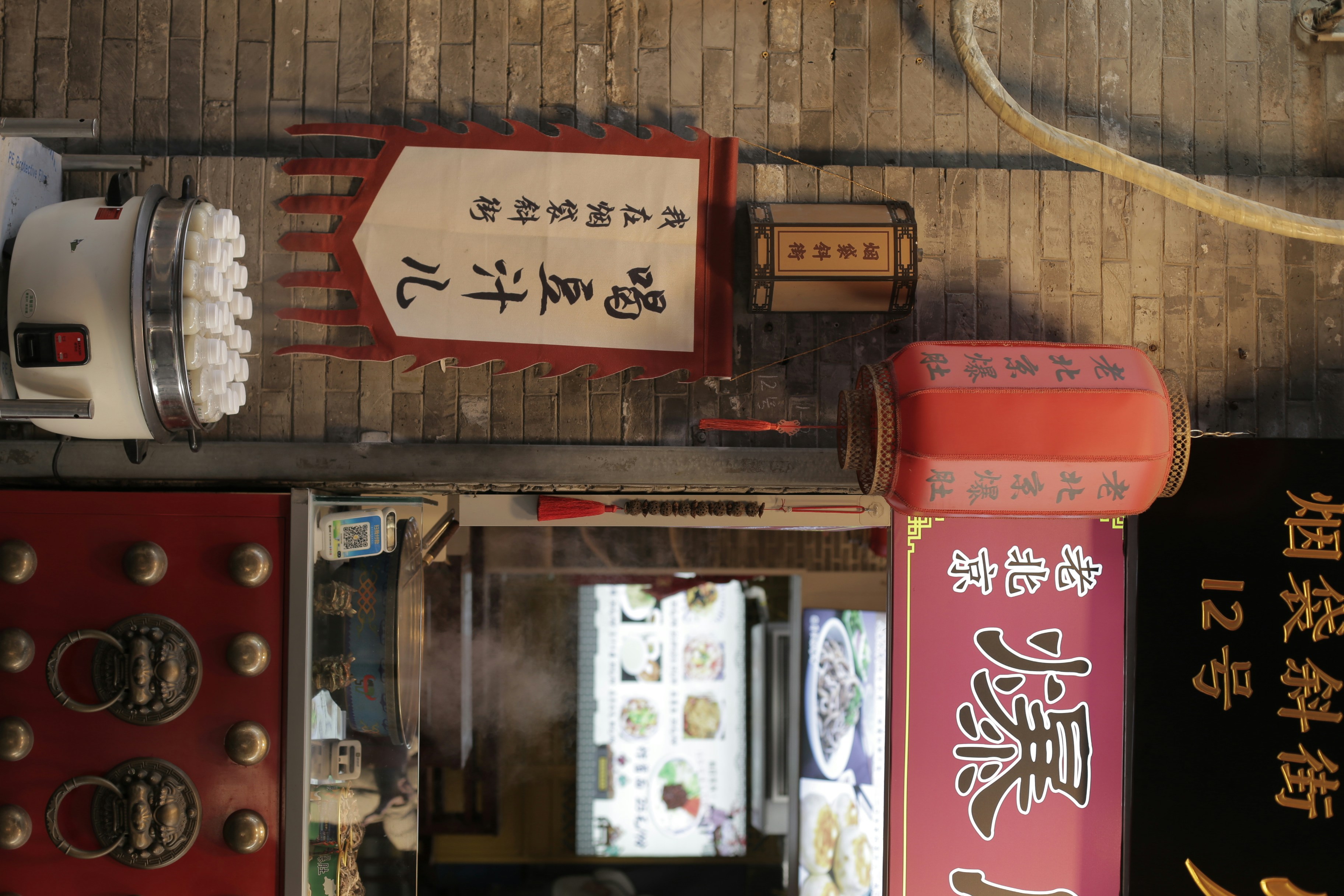 Red Lanterns and Chinese Signboard Glow on a Dim Street Corner