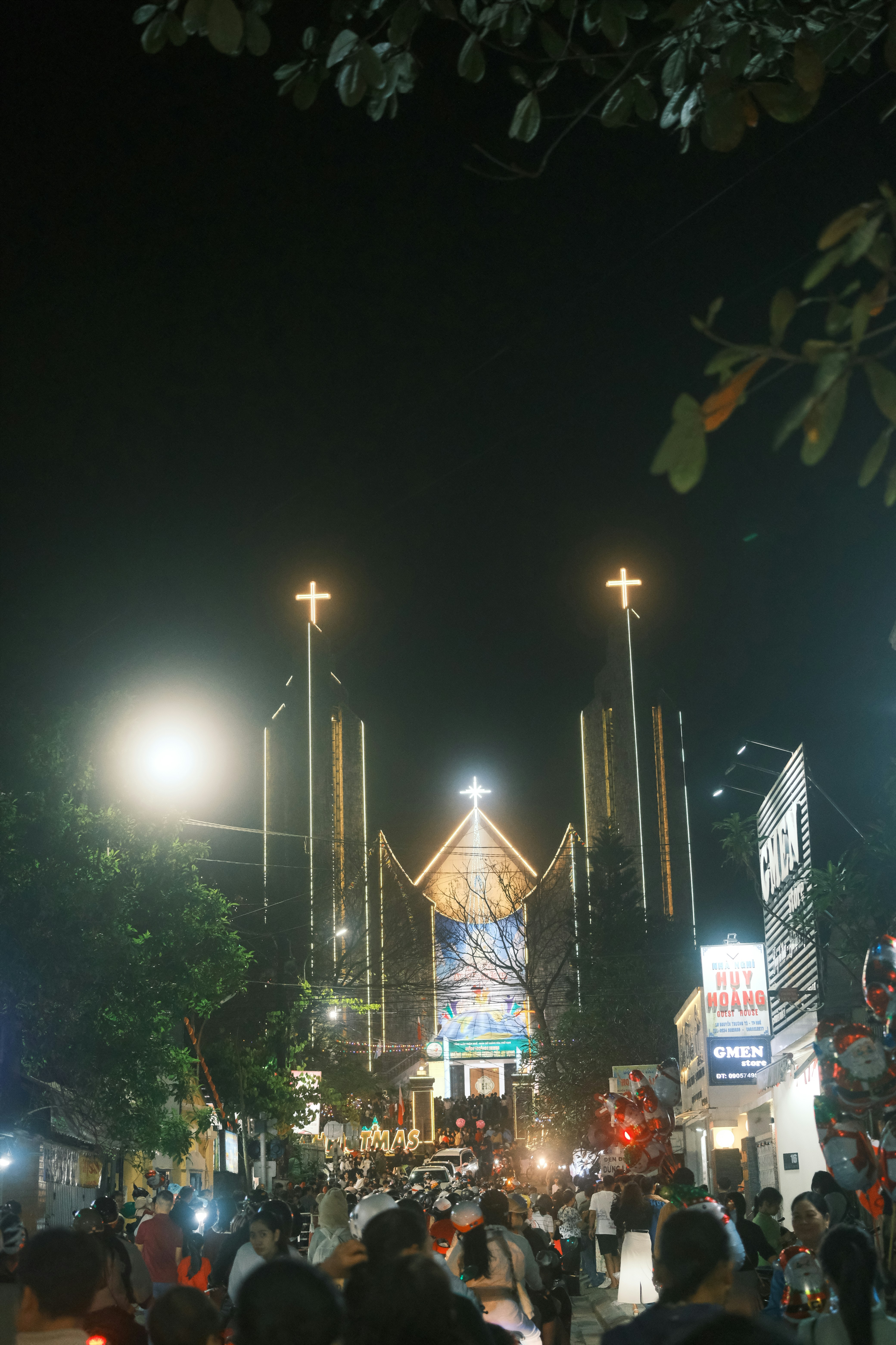 Night Church Street: Neon Glow and Crowded Celebration