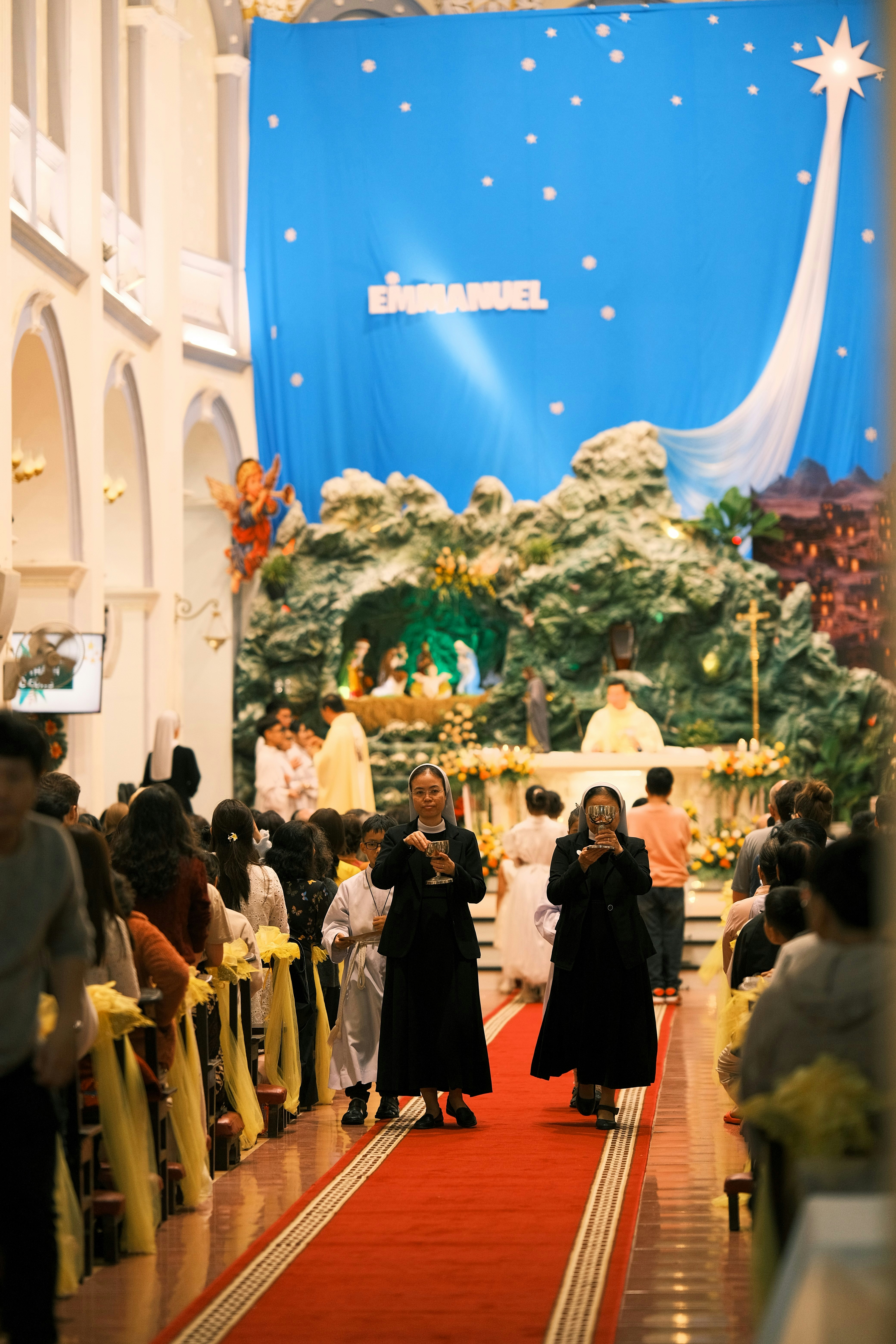 Mid-Aisle Prayer: Two nuns Capture a Moment Before the Ceremony
