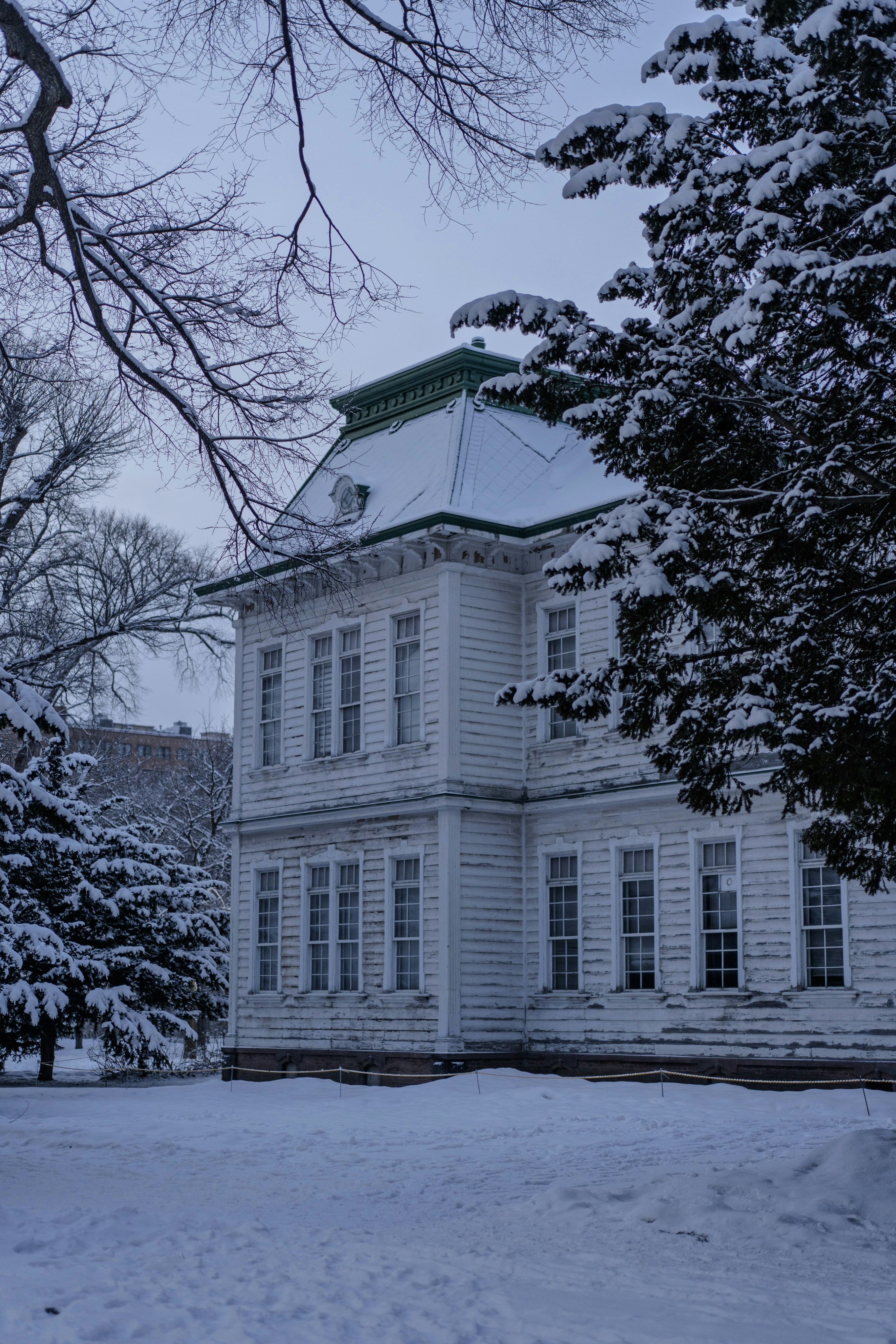 Snowbound Manor: A Heritage House Silhouetted by Winter Silence