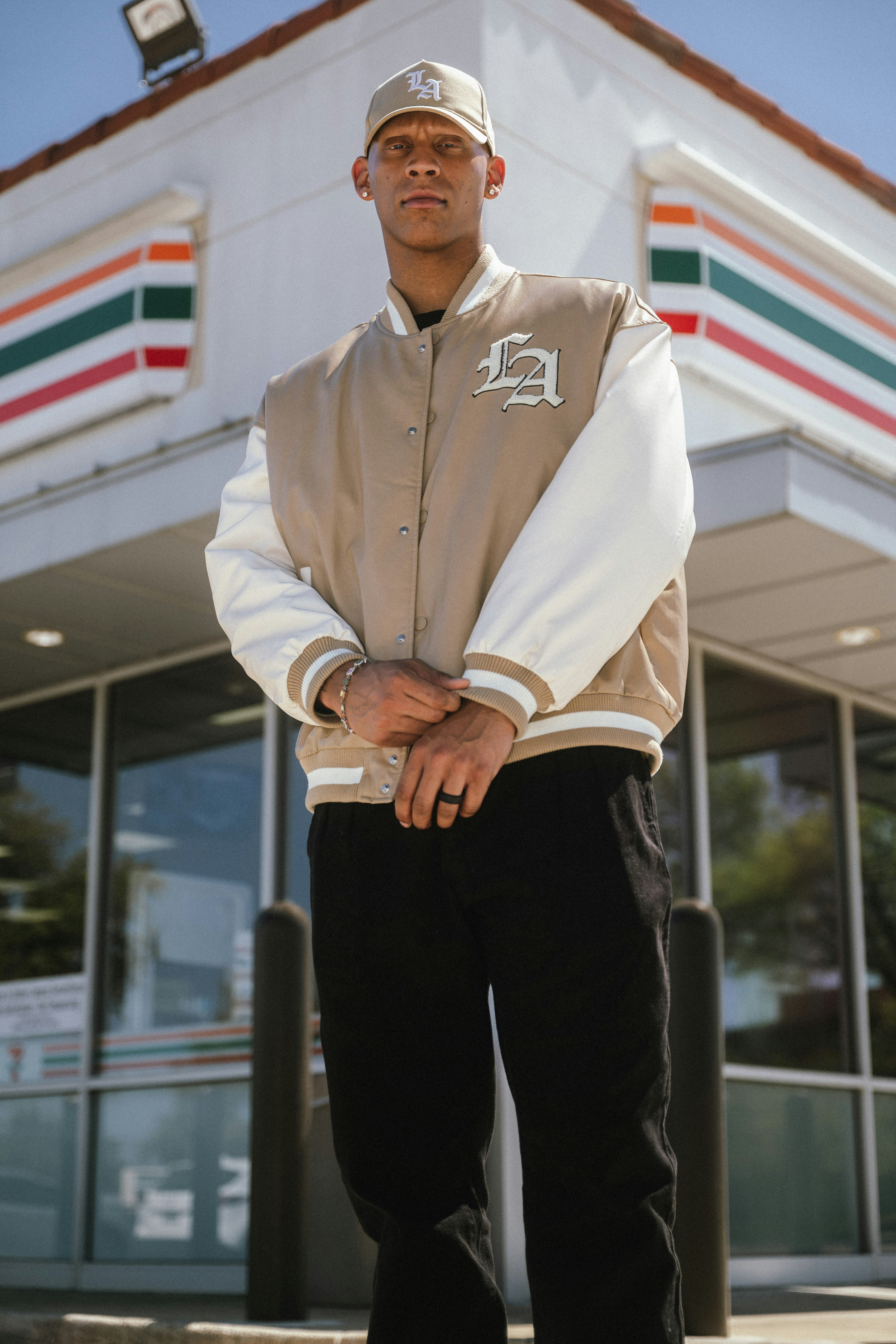 Portrait in Front of a Striped Convenience Store Facade