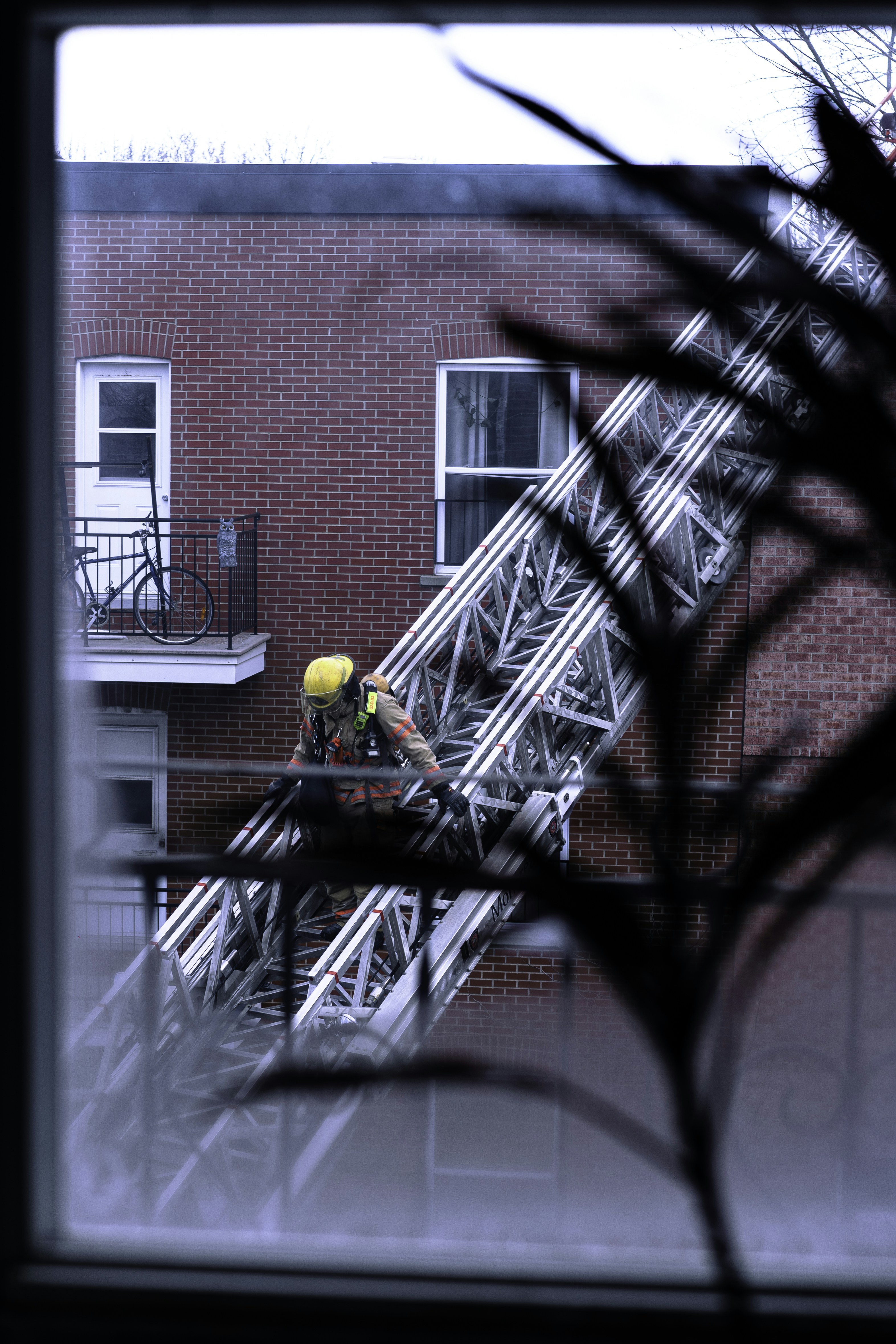 Firefighter Ascending the Ladder: Red Brick backdrop and Hydraulic Frame