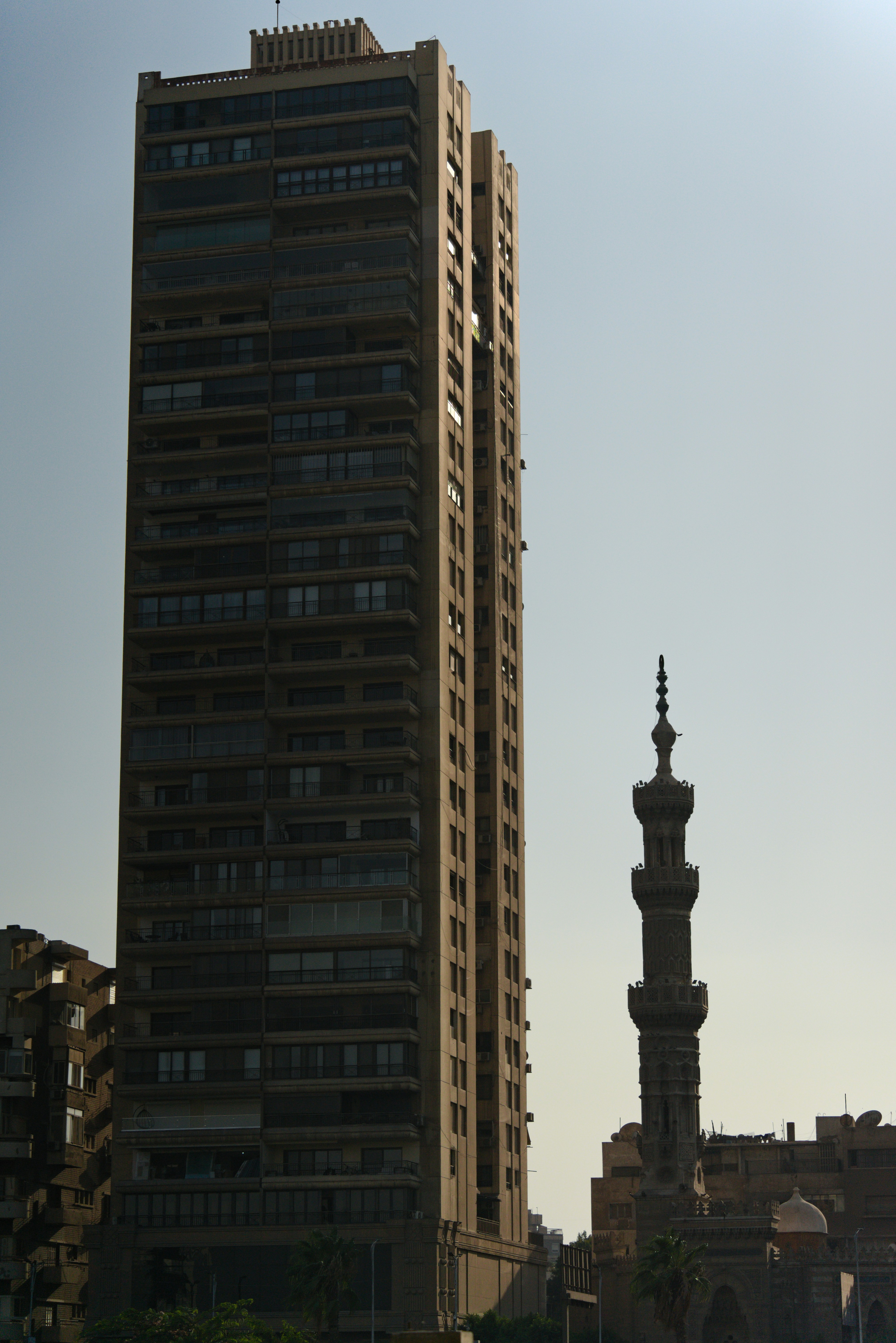 Vertical Giants: A Cityscape Framed by a Towering Facade