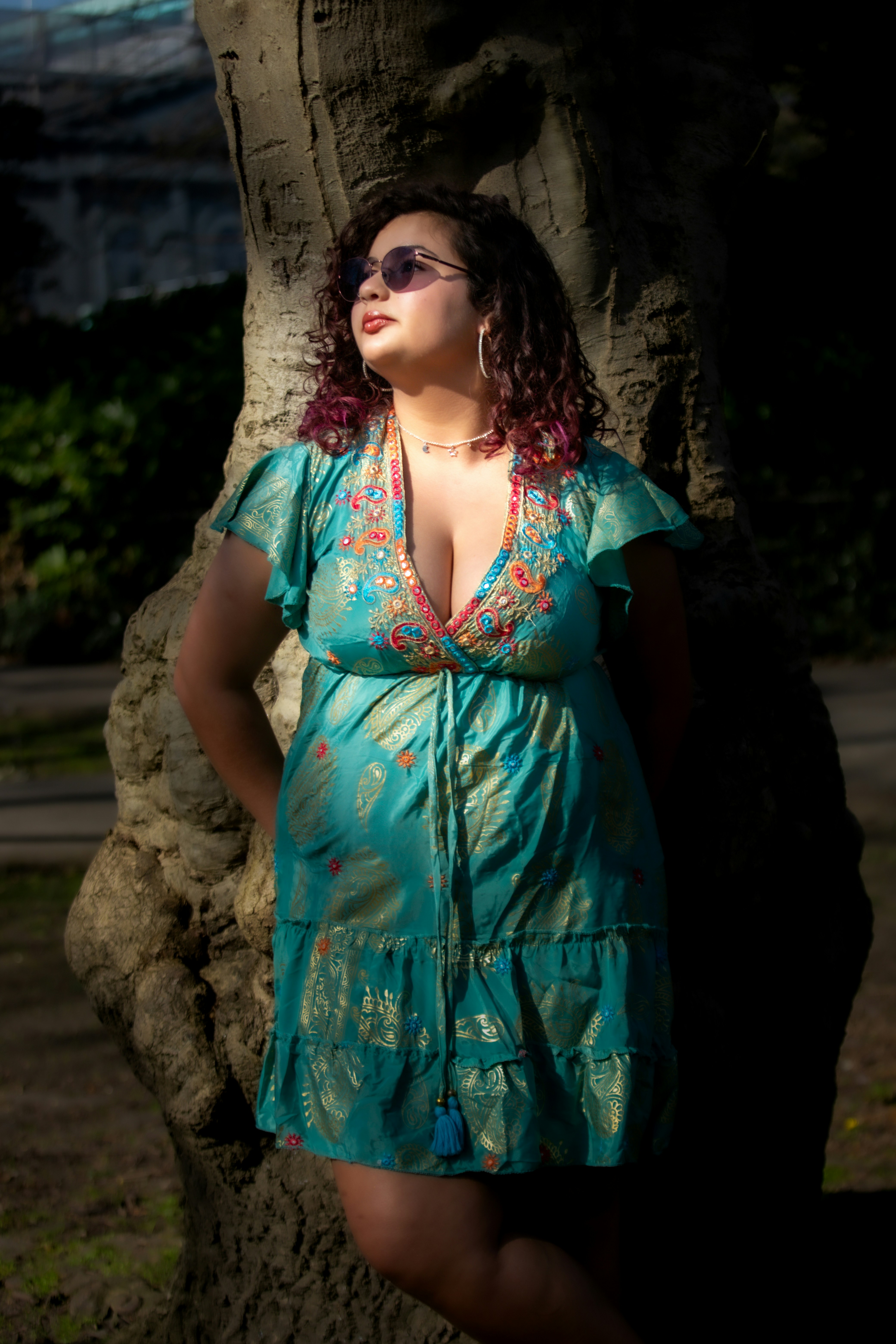 Sunlit Teal: A Quiet Confidence by the Tree