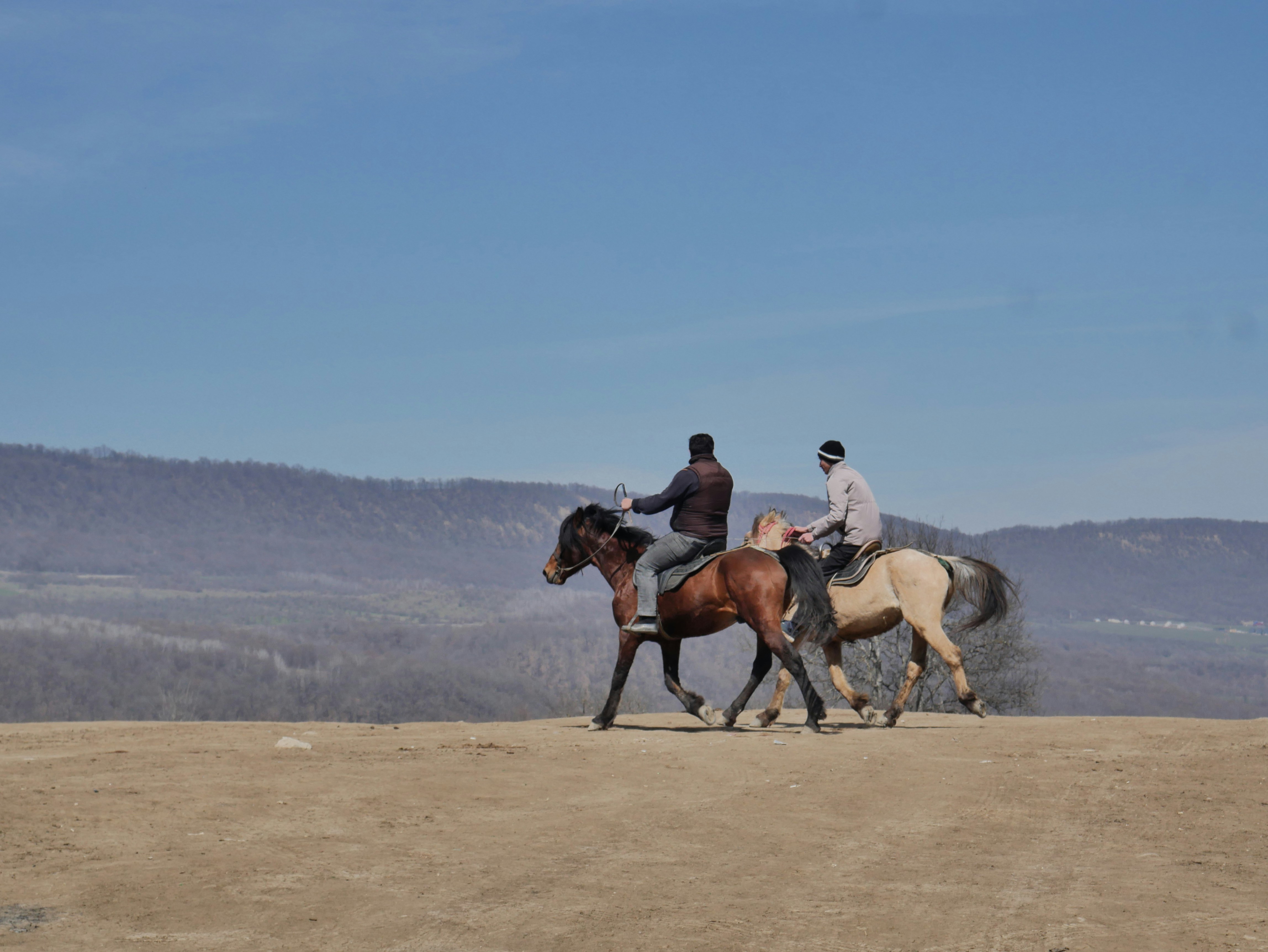 Three Riders in a Pale Desert March
