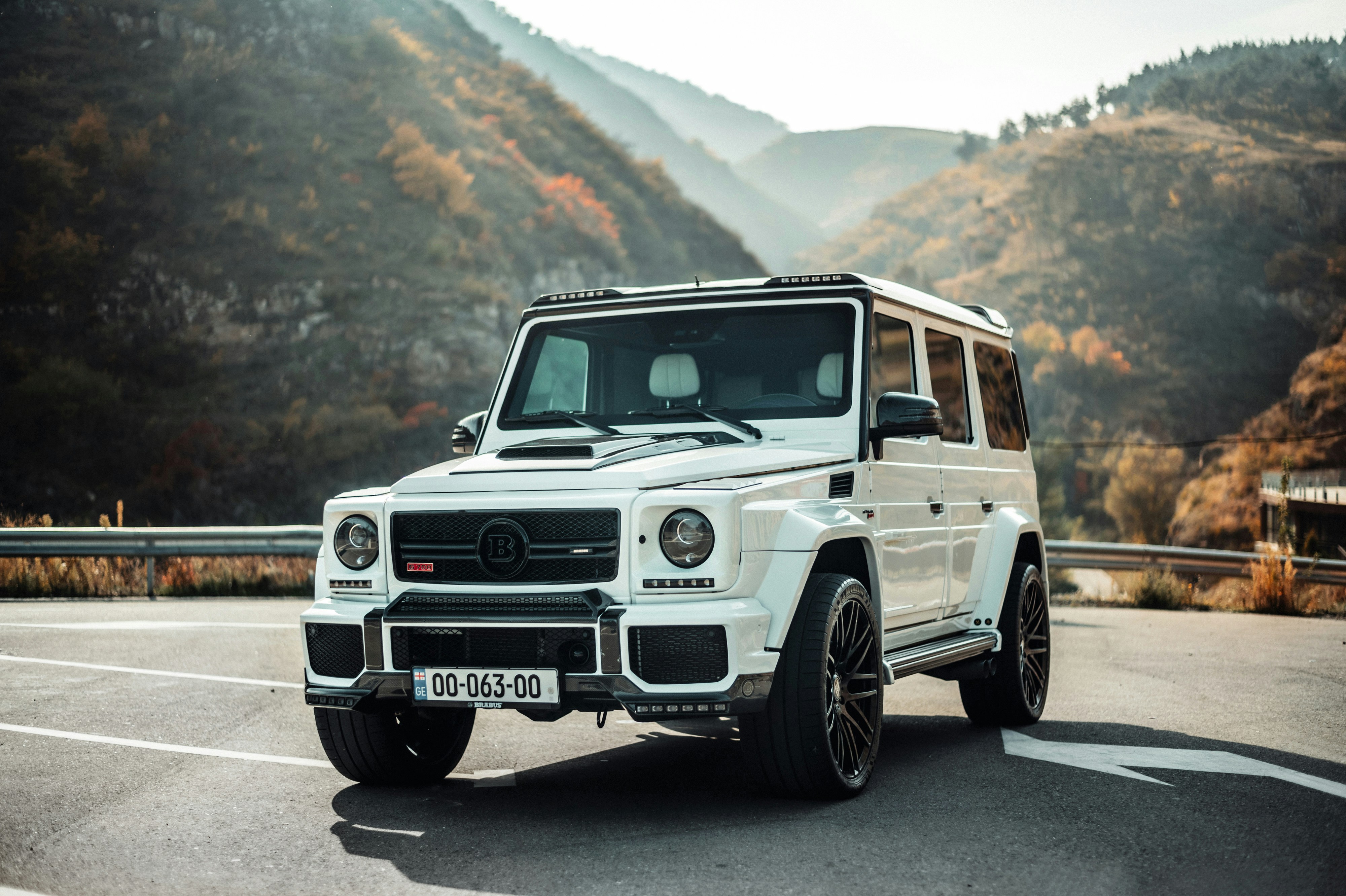 White Mercedes G-Class on Scenic Mountain Road