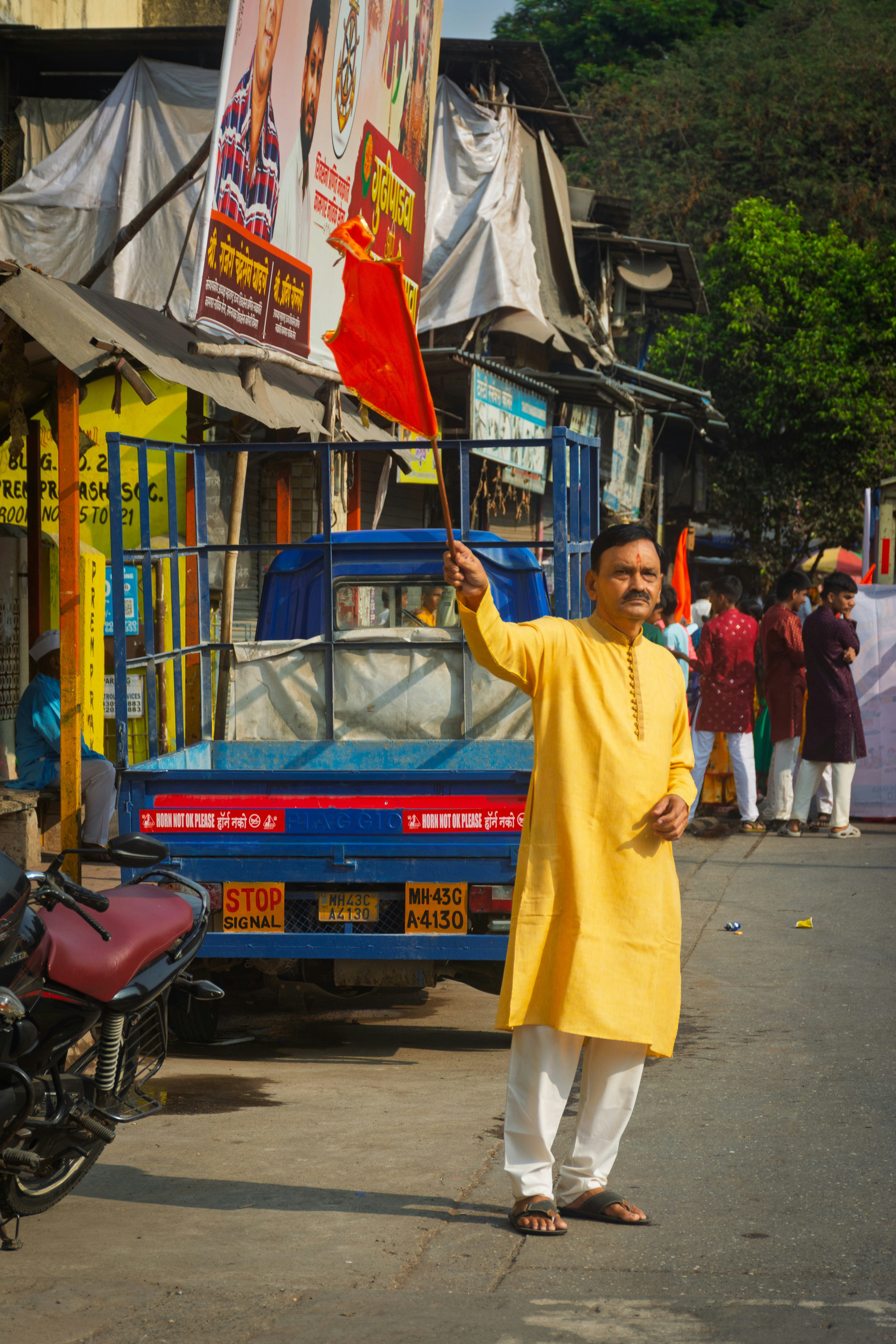 The Yellow-Curtain Messenger in a Bustling Indian Street