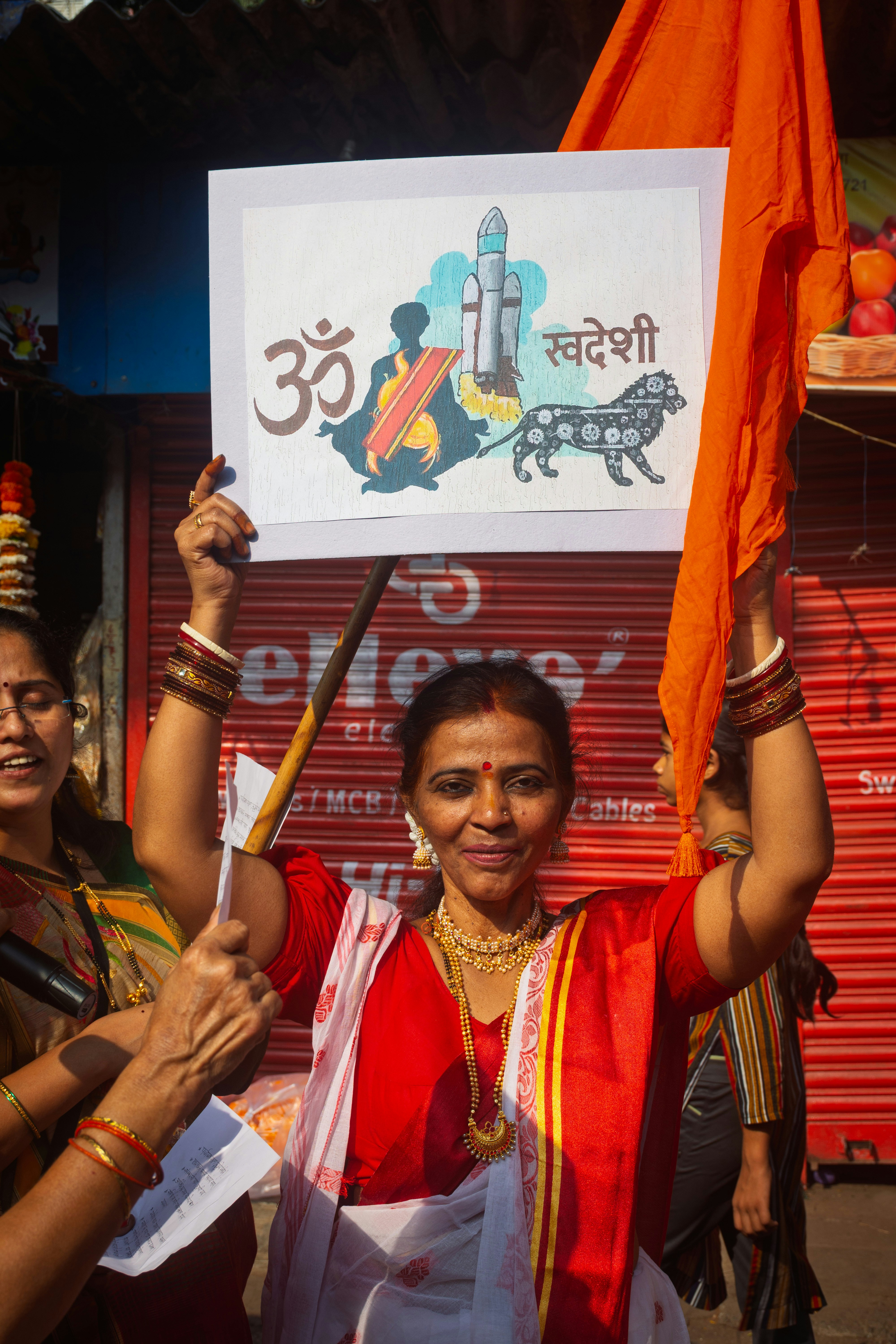 Vivid Parade: A Woman Holds Alight Banner Amid Festive Hue