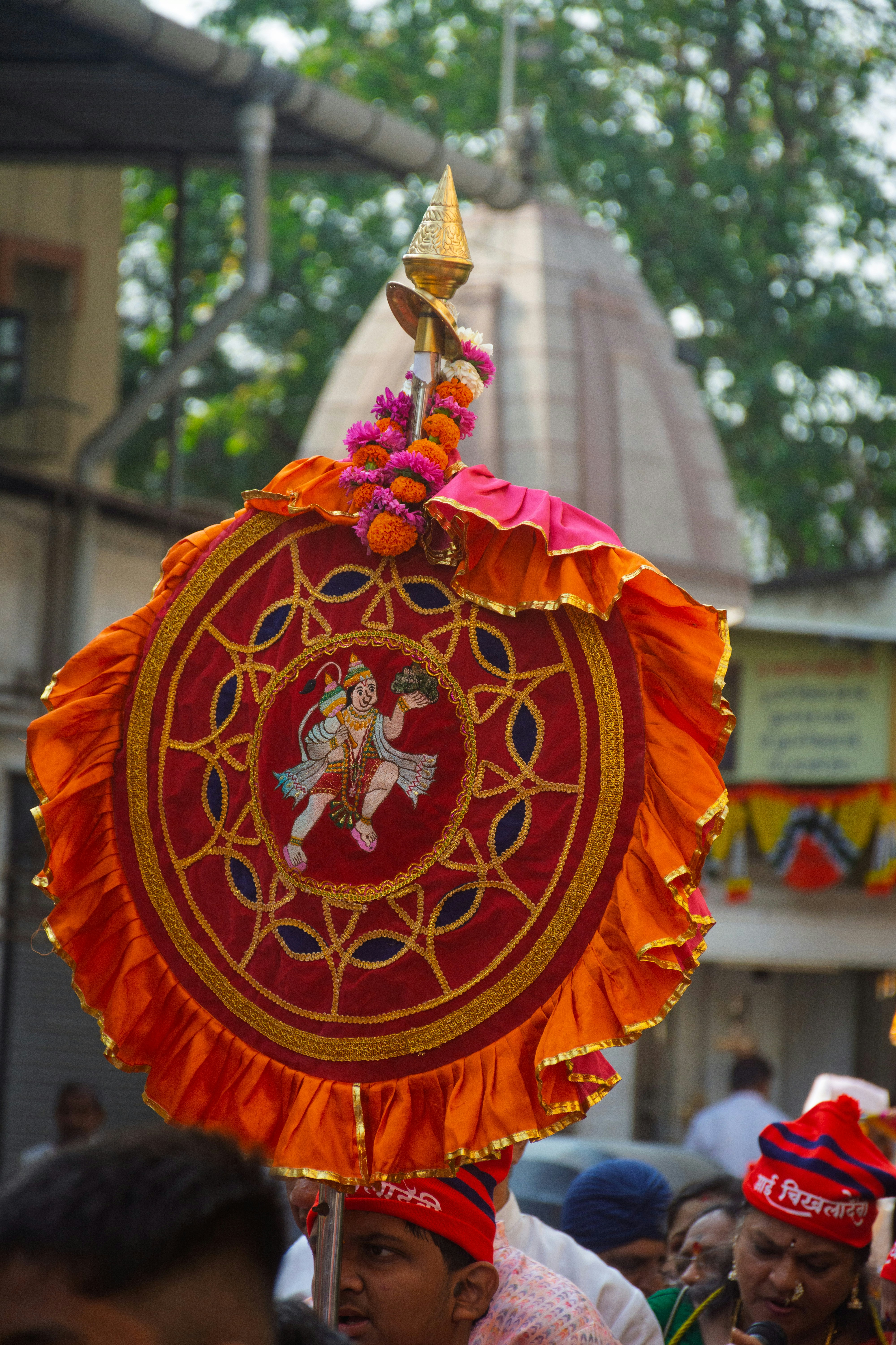 Ornate Festival Banner Rising Above the Crowd
