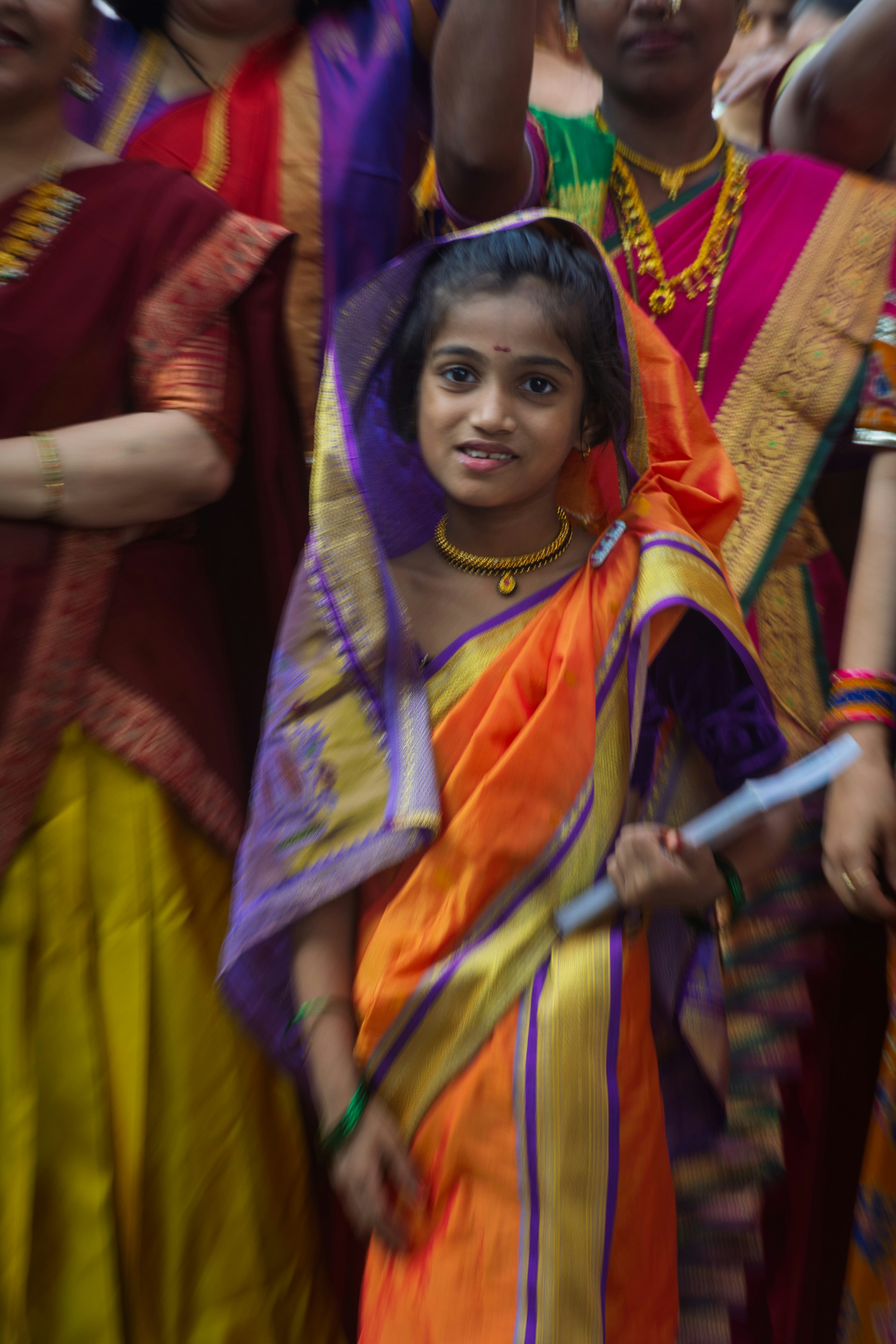 Youthful Grace in a Rainbow of Sarees