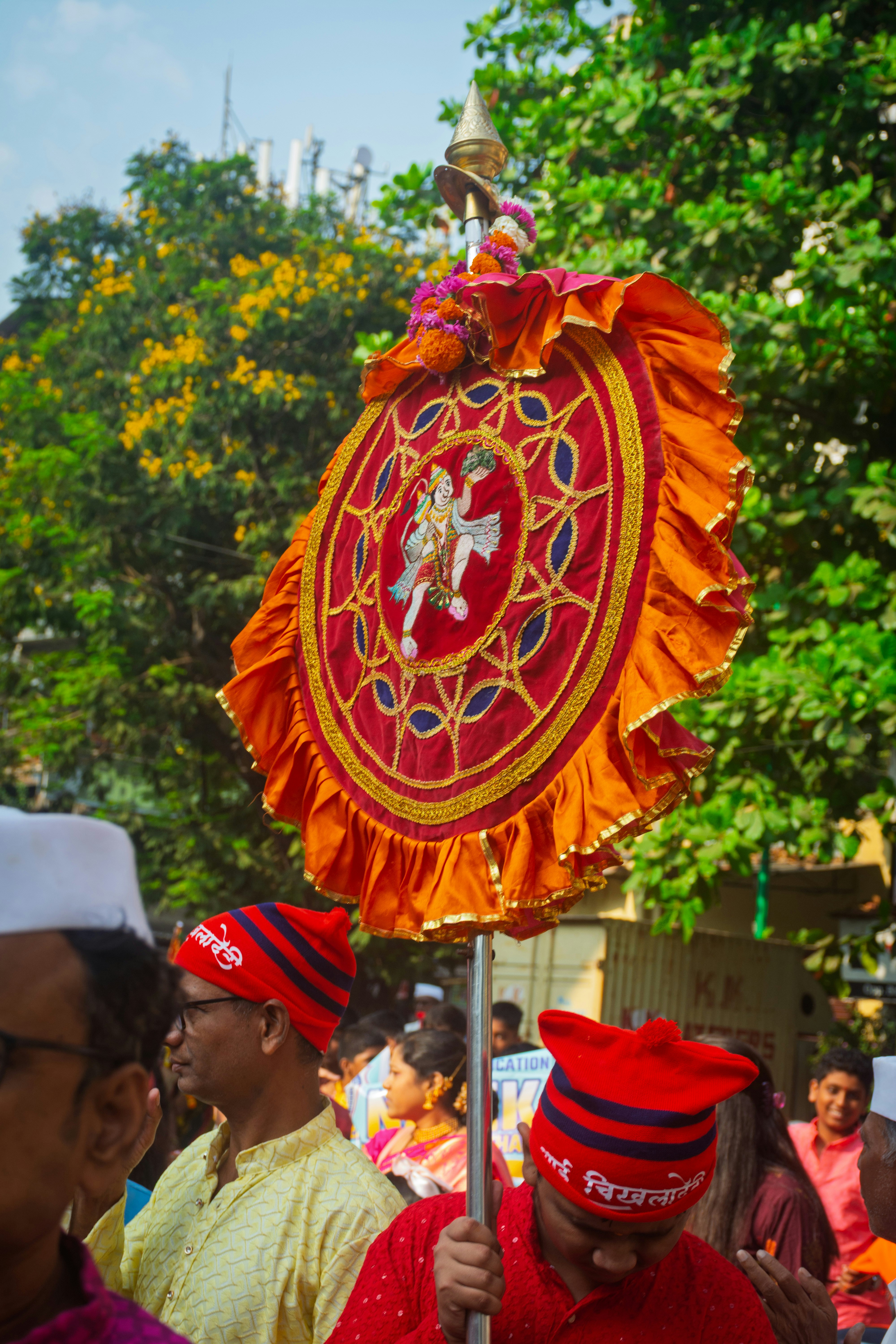 Vibrant Festival Umbrella: Silk Circle Amid the Crowd