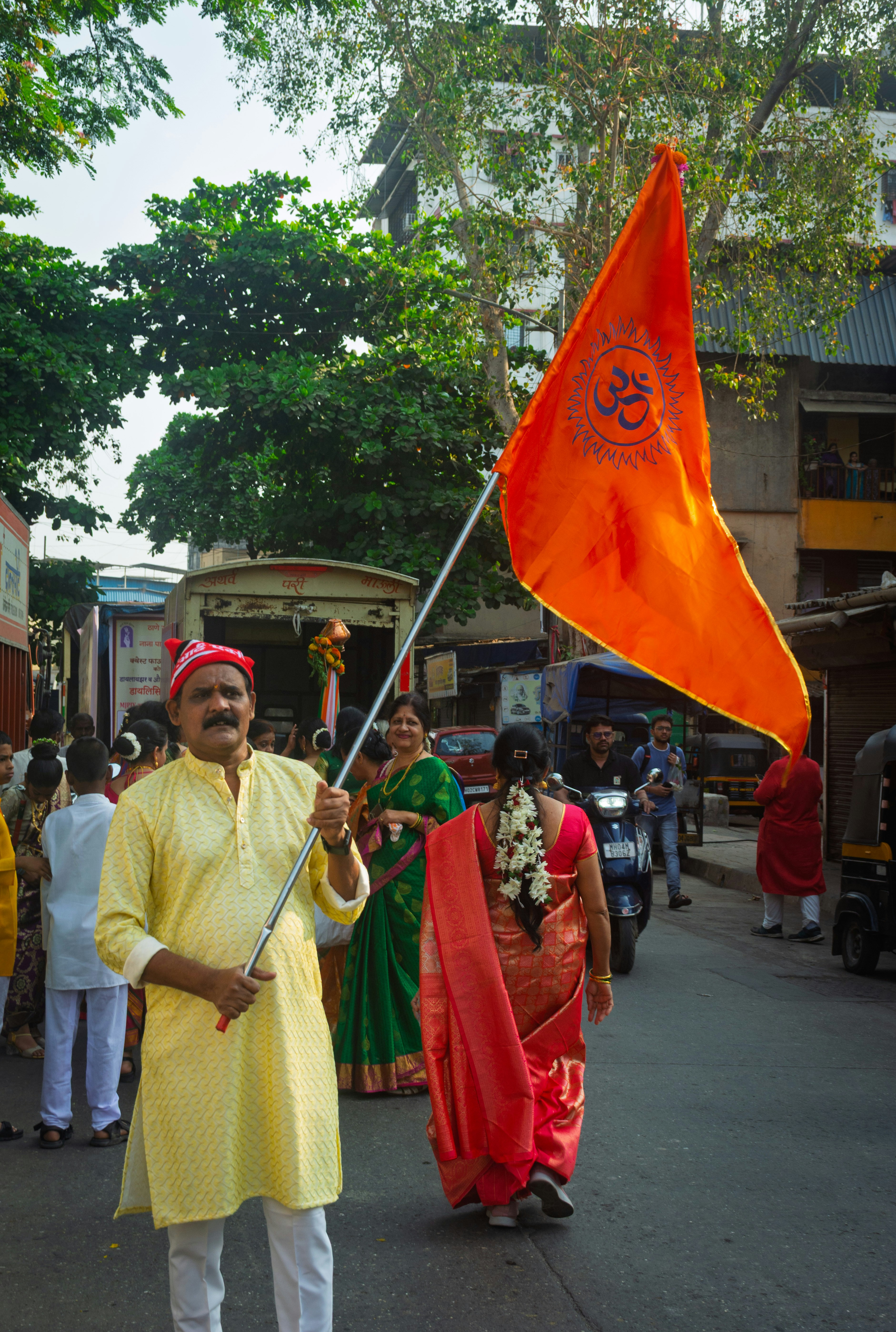 Flag Bearer in a Colorful Street Parade