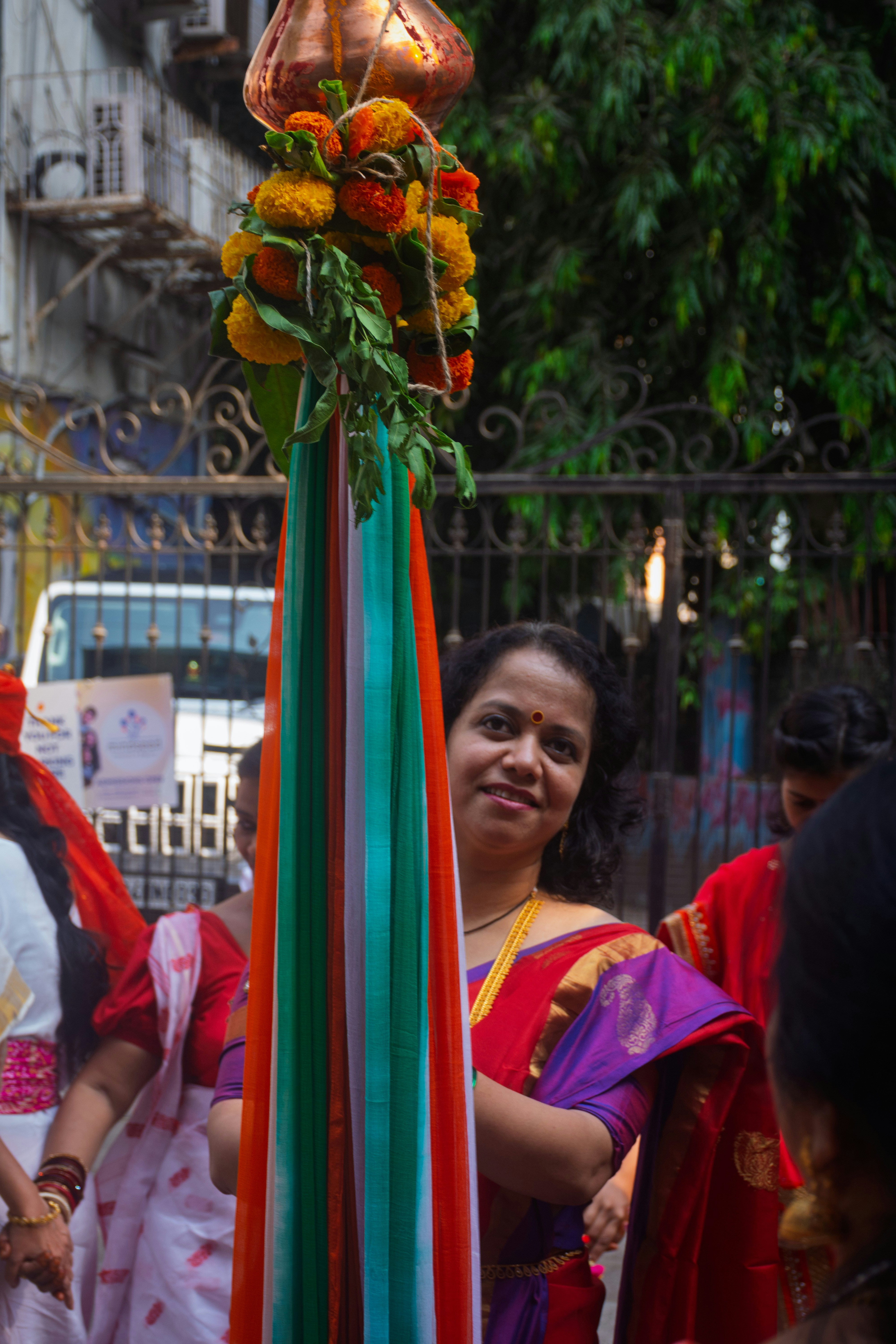Festive Ribbon Cascade Framing a Smiling Plate-Headed Woman