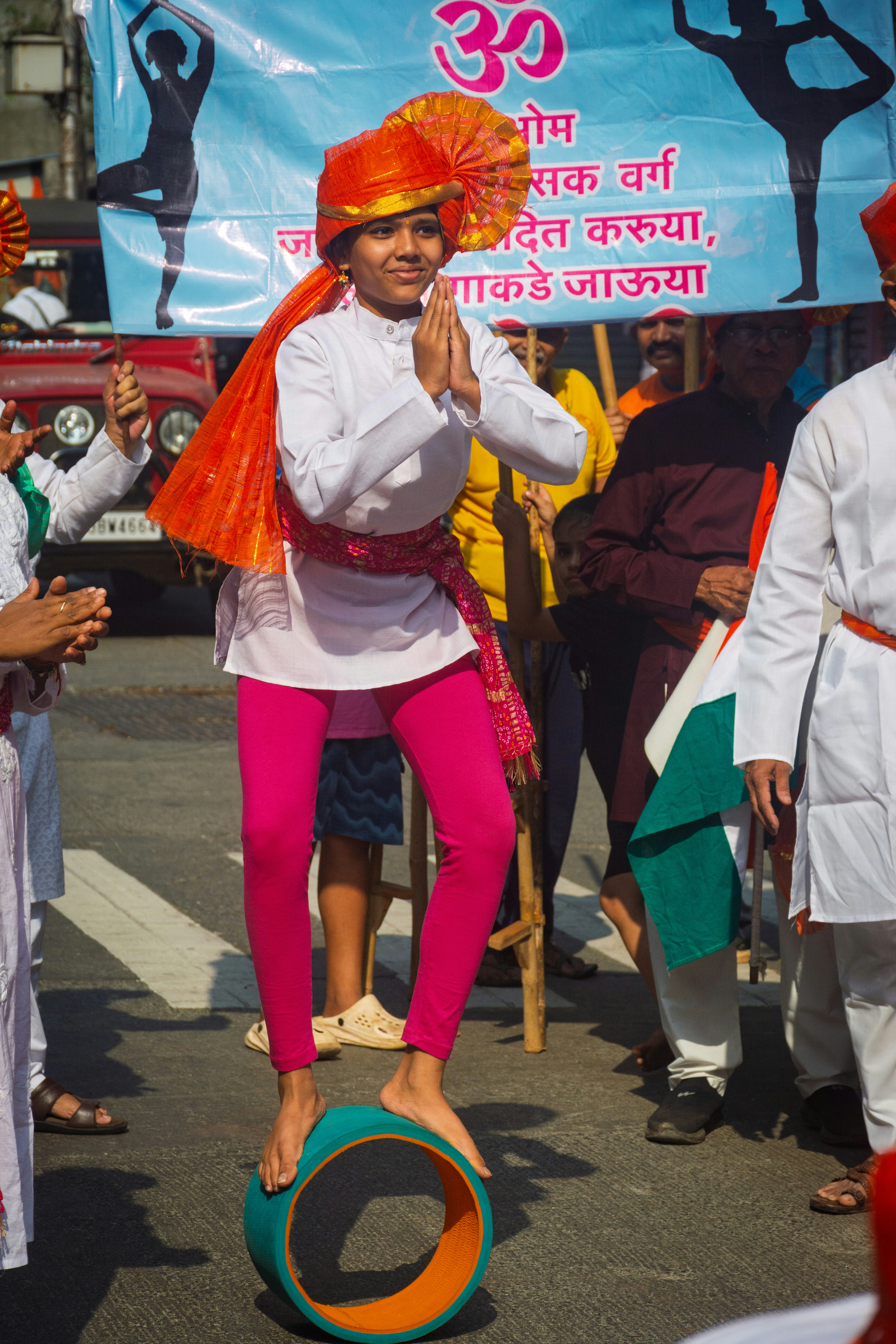 Balancing Act: A street performance on a vivid festive street