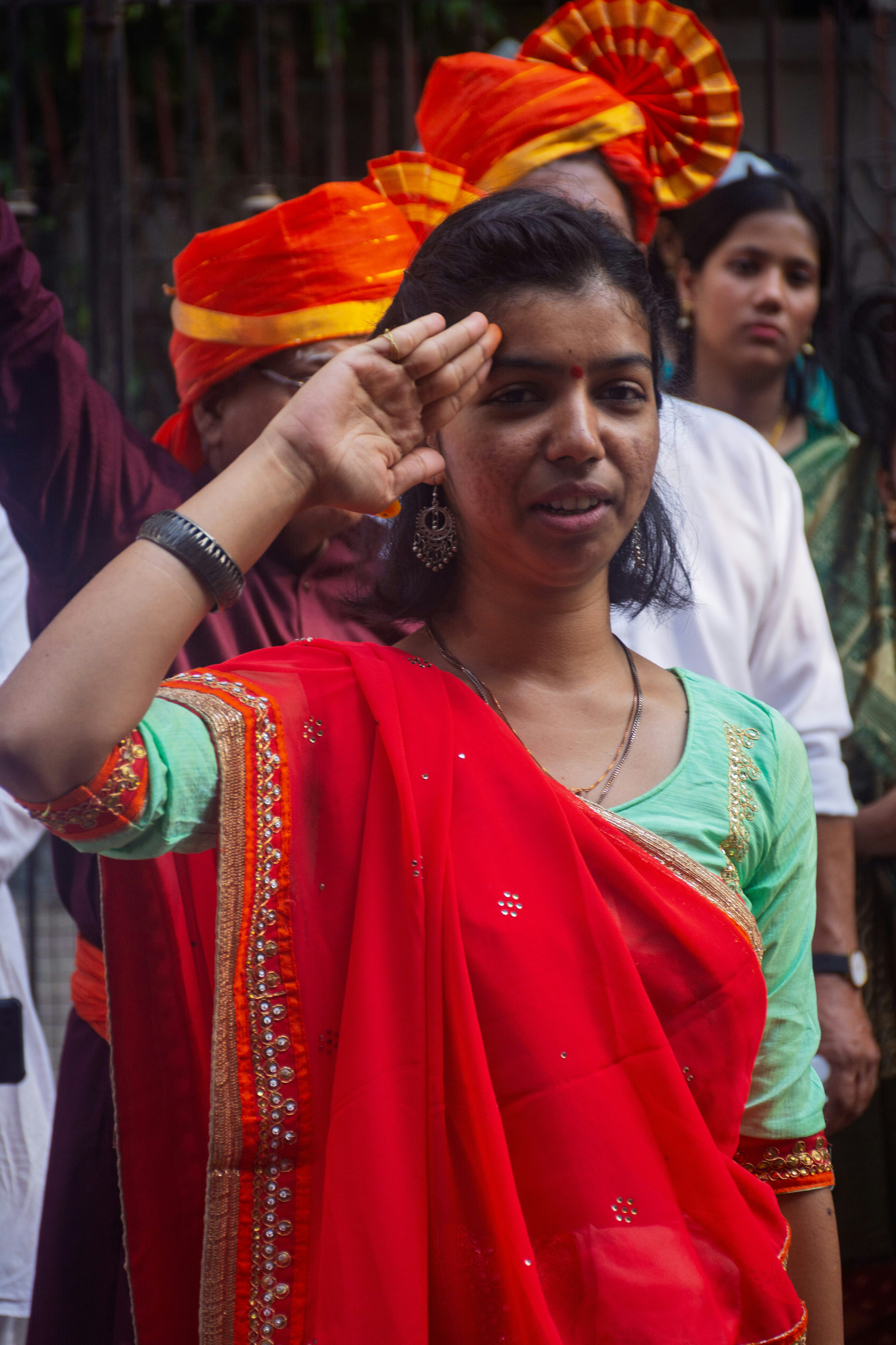 Vibrant Salute: A Dressed-For- celebration portrait amid dancers