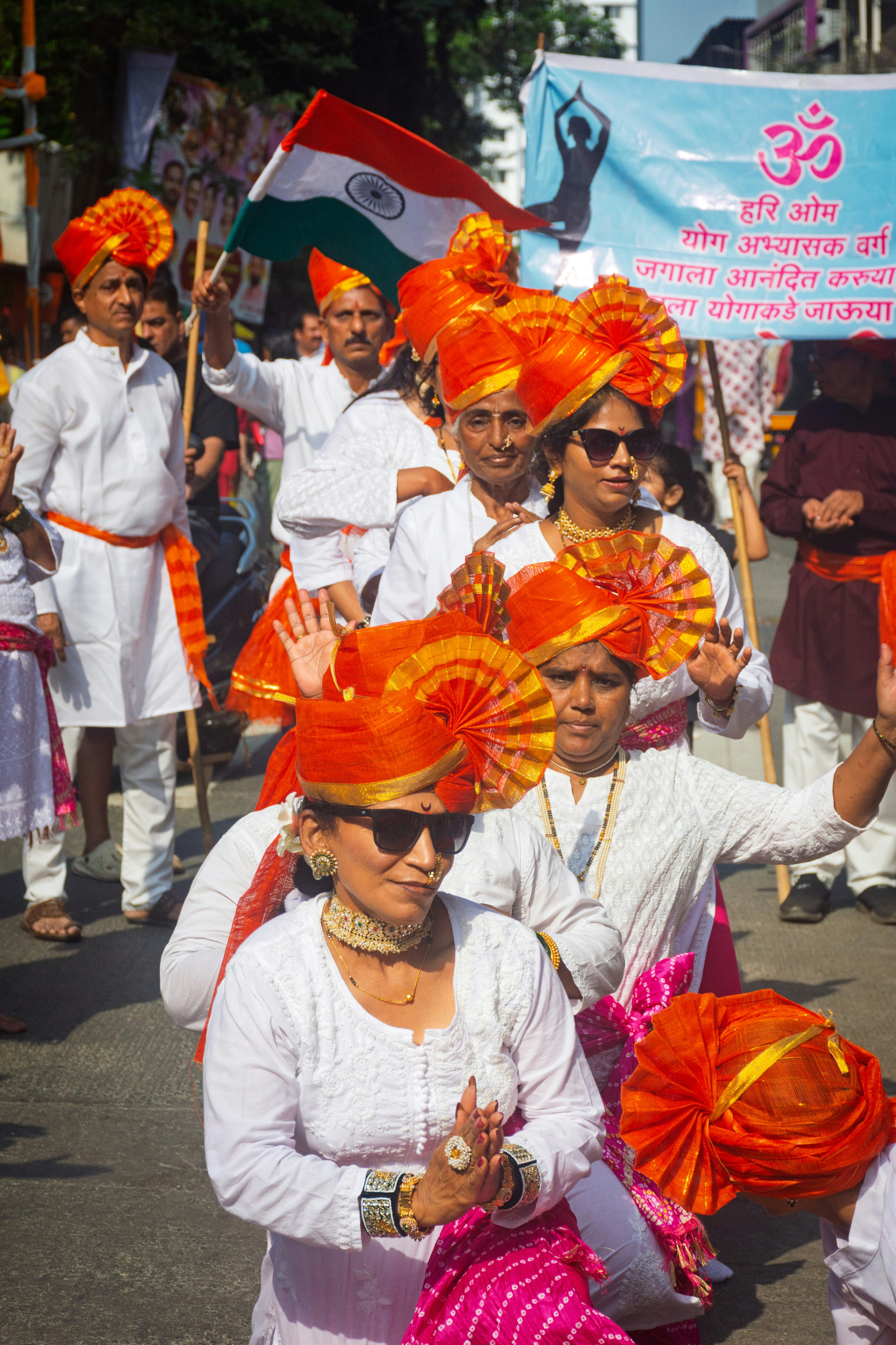 Orange Turbans and Indian Pride: A Street Celebration in White Attire
