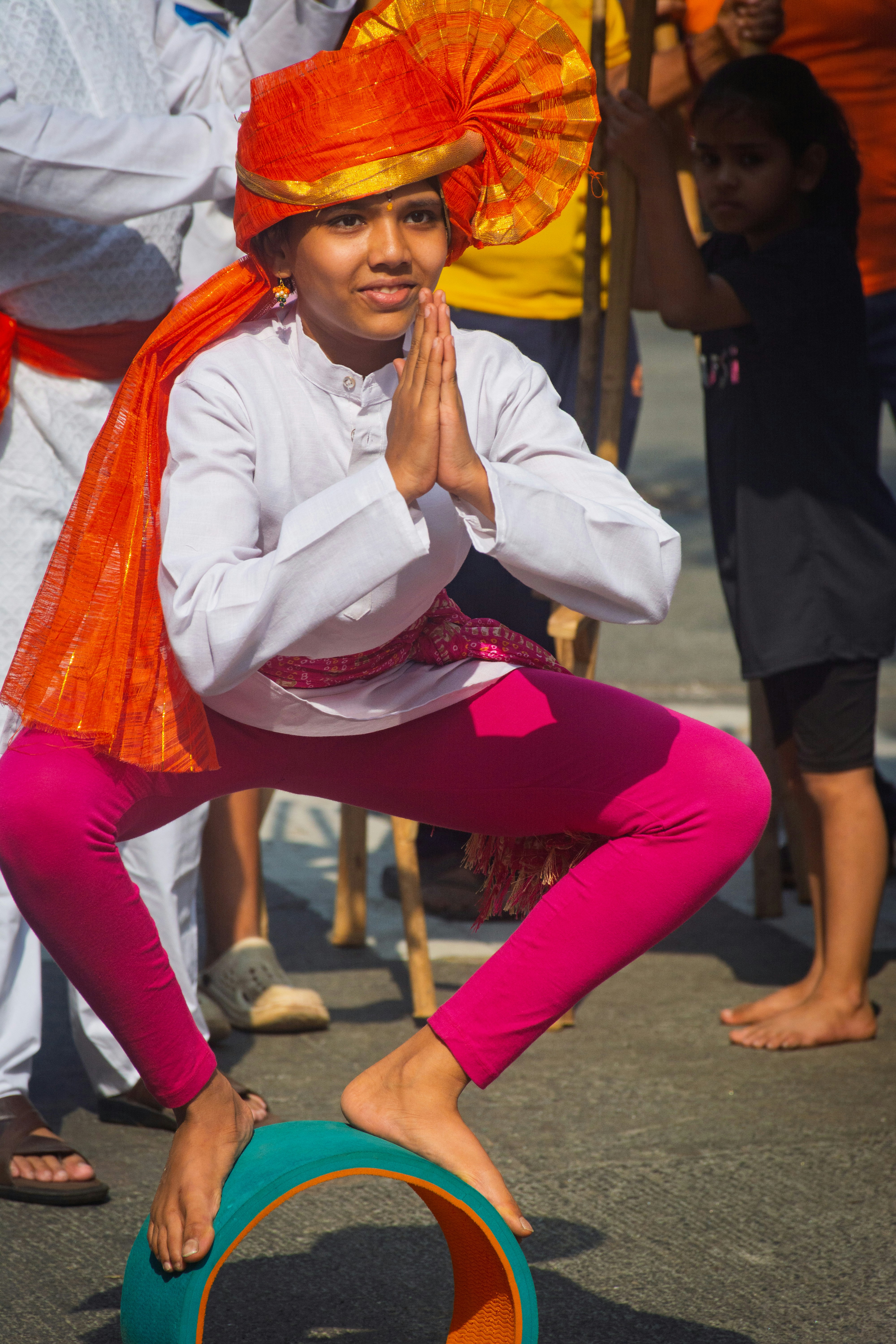 Energetic Yoga Pose with Traditional Turban and Bright Accents
