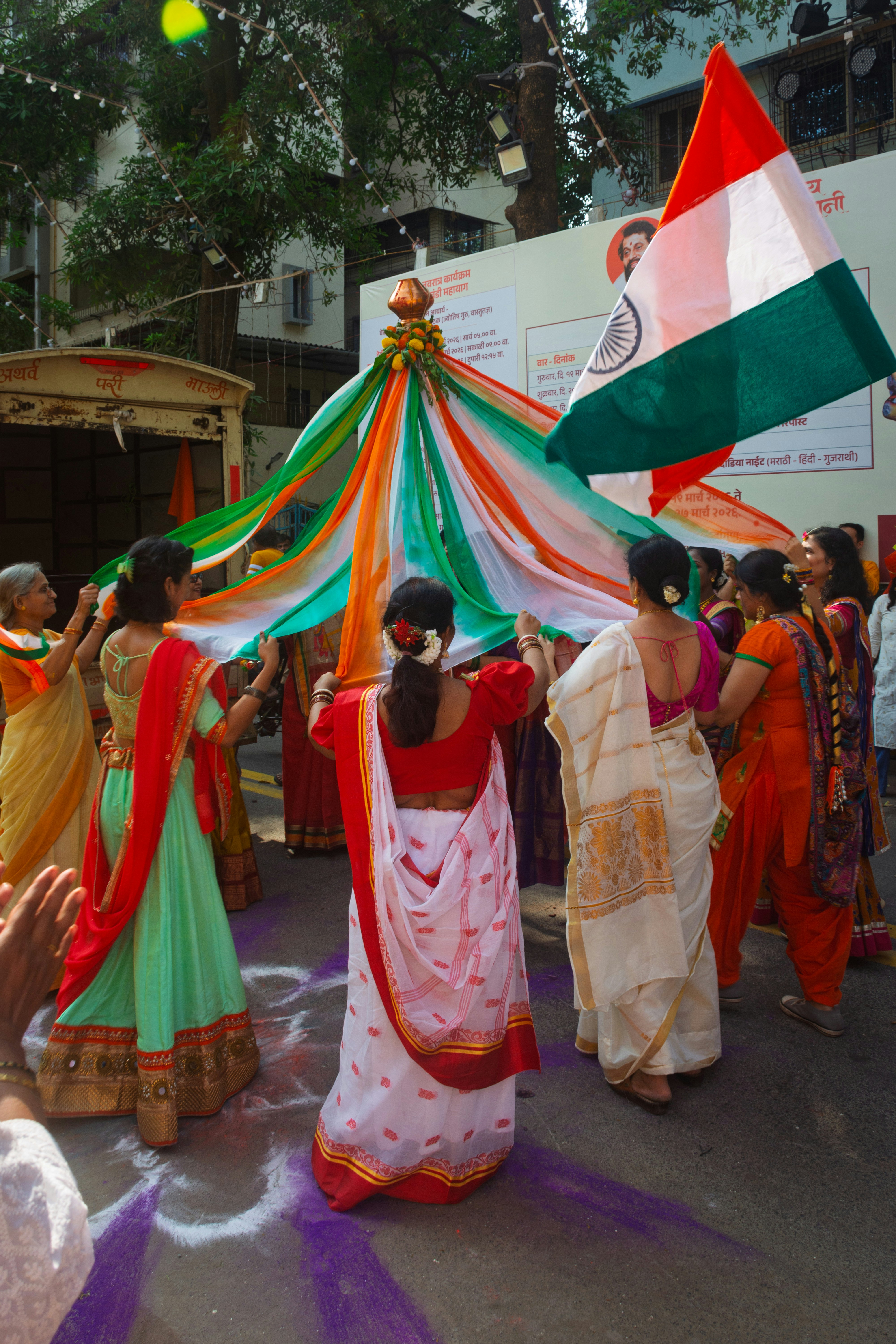 Flag of Unity: Dancers Celebrate an Indian Festival Around a Colorful Crest