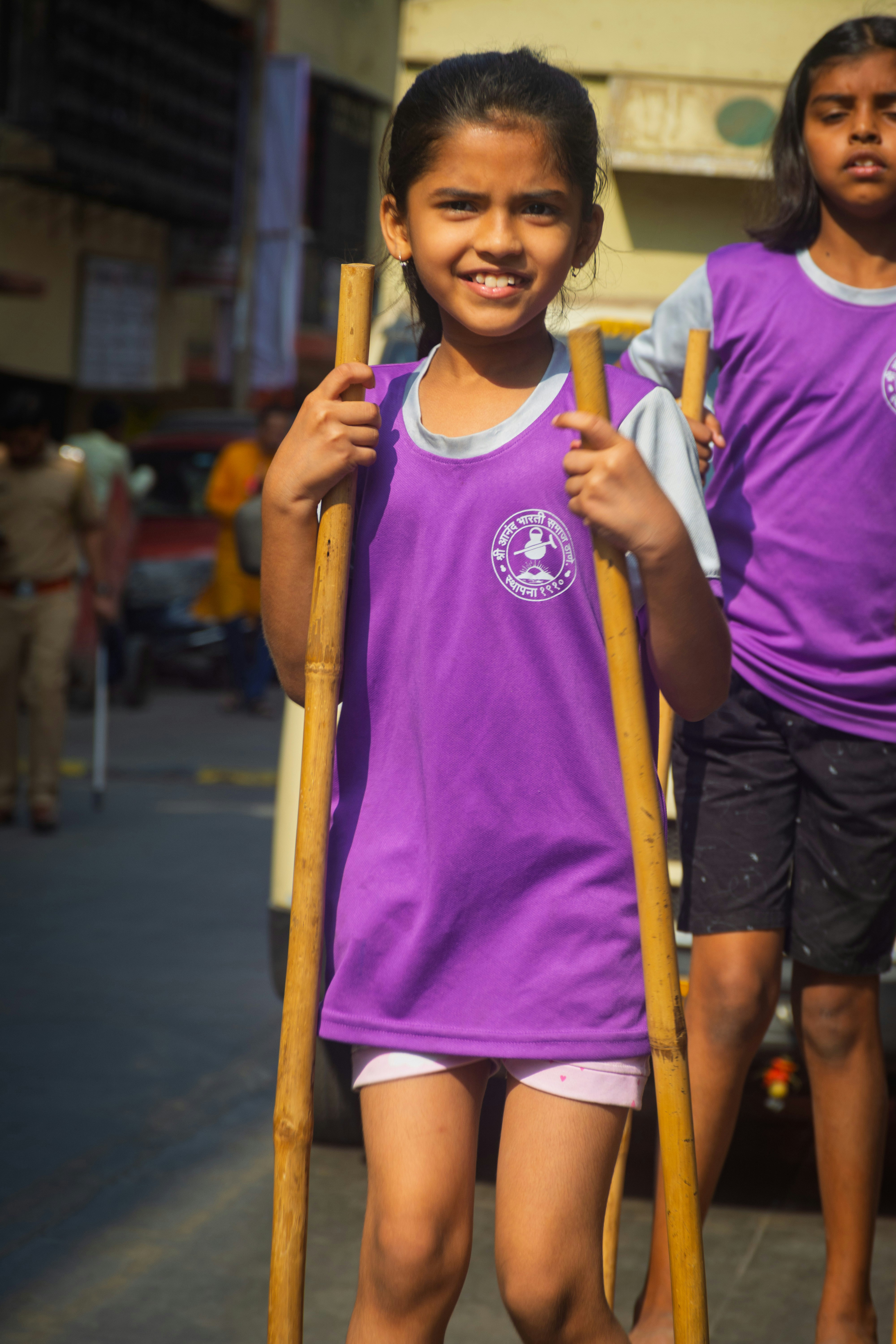 Purple Uniforms in the Street: A Moment of Courage with Crutches