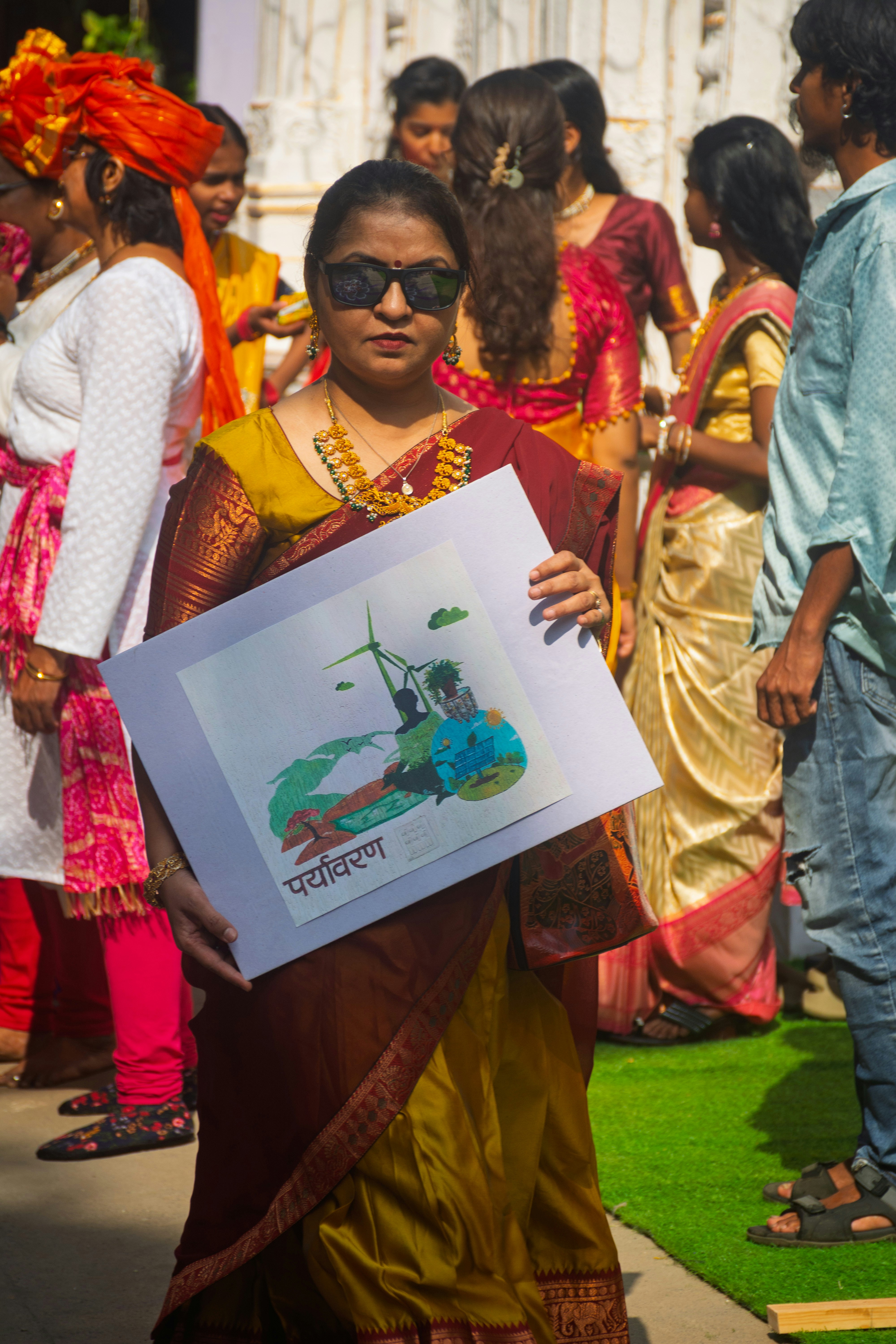 Herald of Color: Woman with Poster at a Festive Gathering