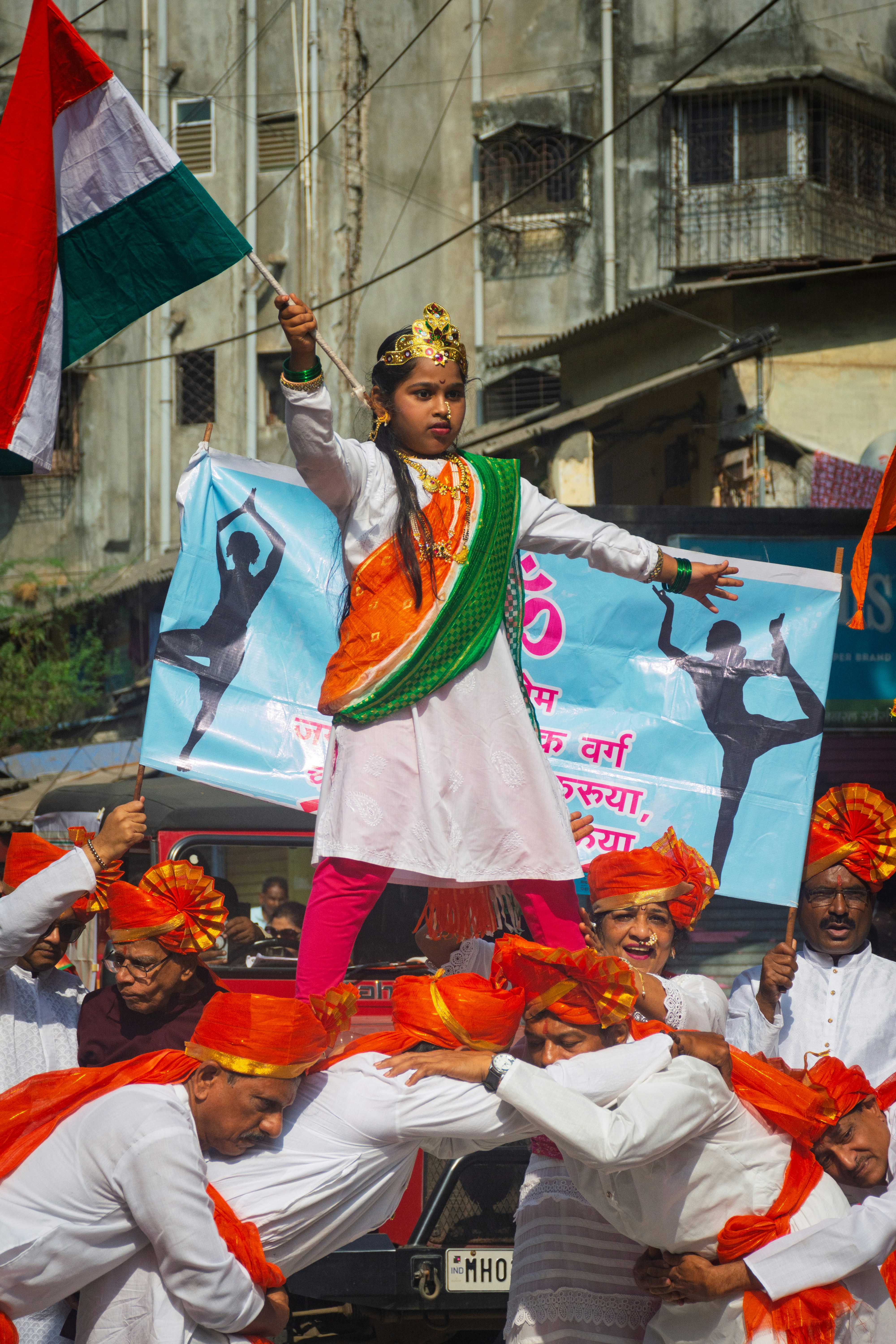 Diva on Parade: A Child Dancer Leads a Colorful Street Performance
