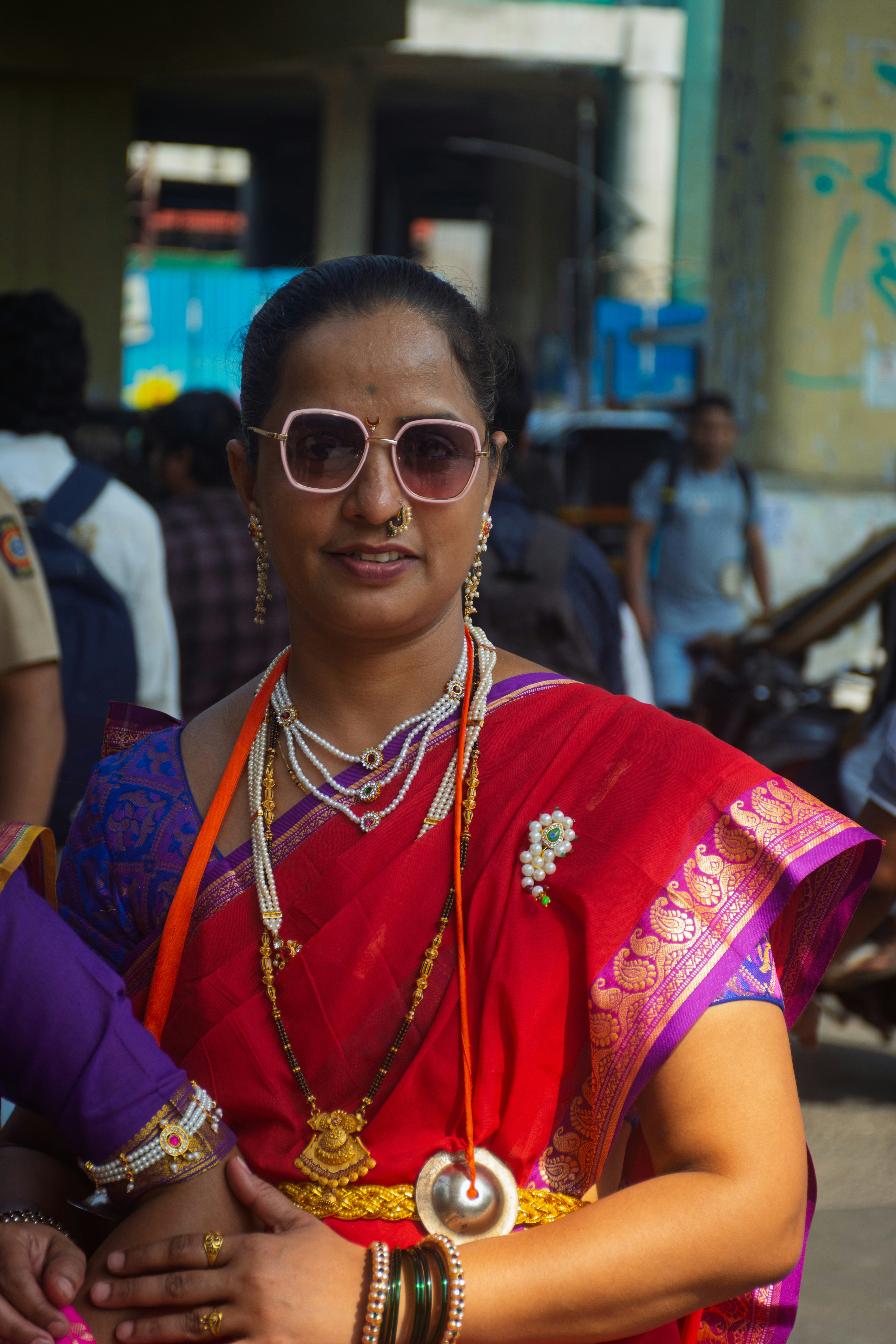 Elegant Grace in Colorful Saree: Portrait at a Busy Street Stand