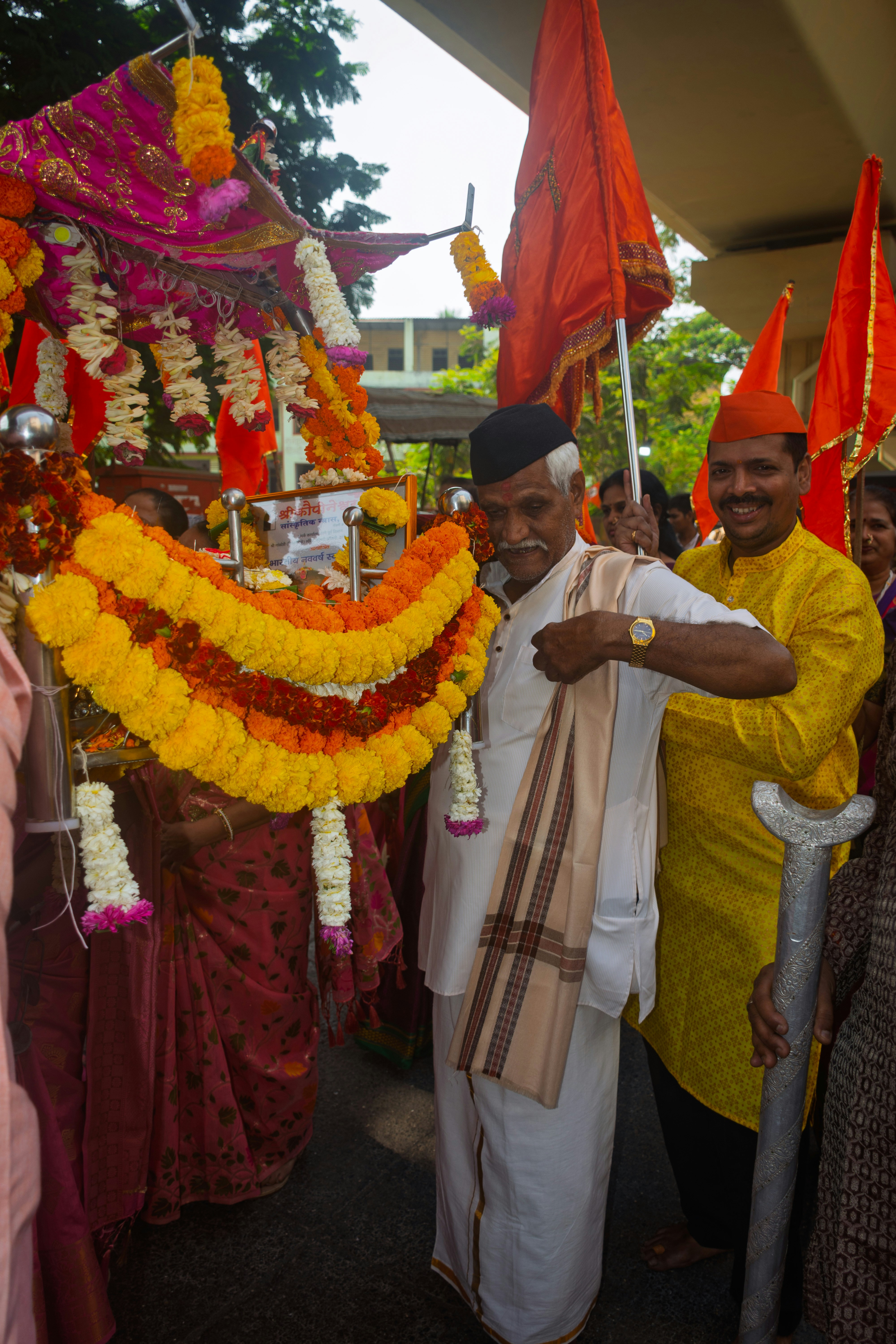 Marigold Ceremony: A Dignified Welcome under Orange Banners