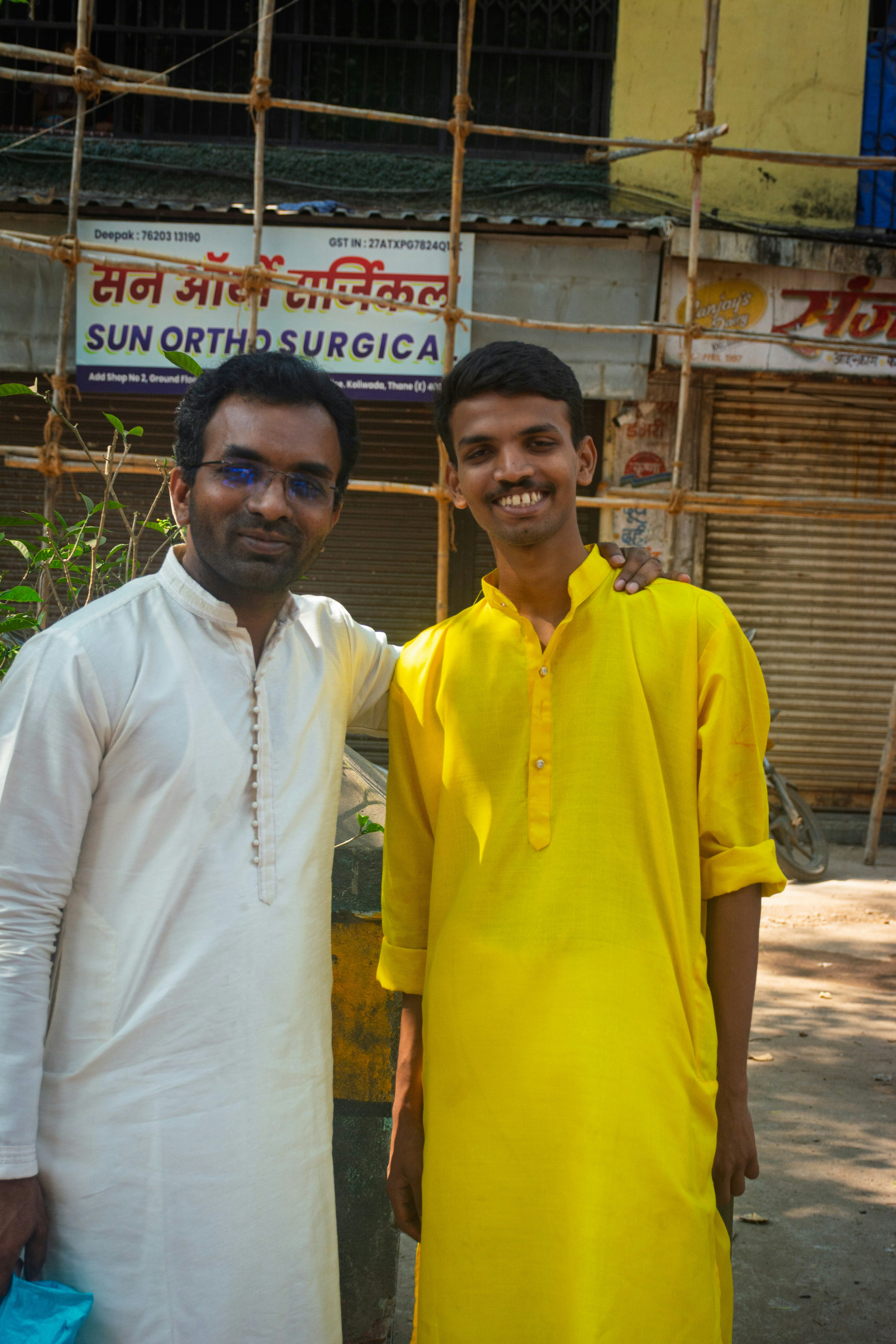 Two Friends, One Yellow Shirt: A Street Portrait in Golden Light