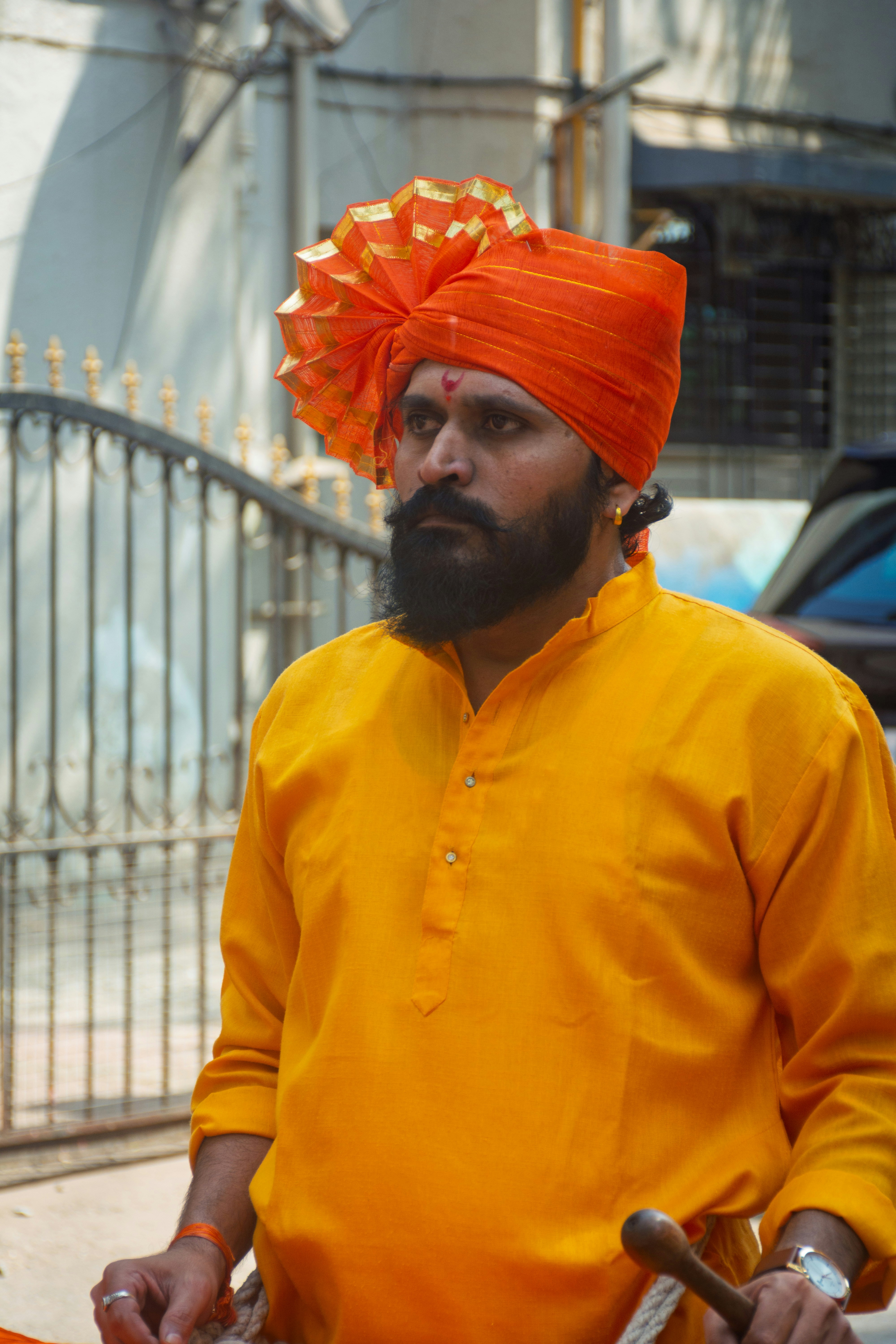 Orange Turban, Bold Presence: A Portrait in Warm Light