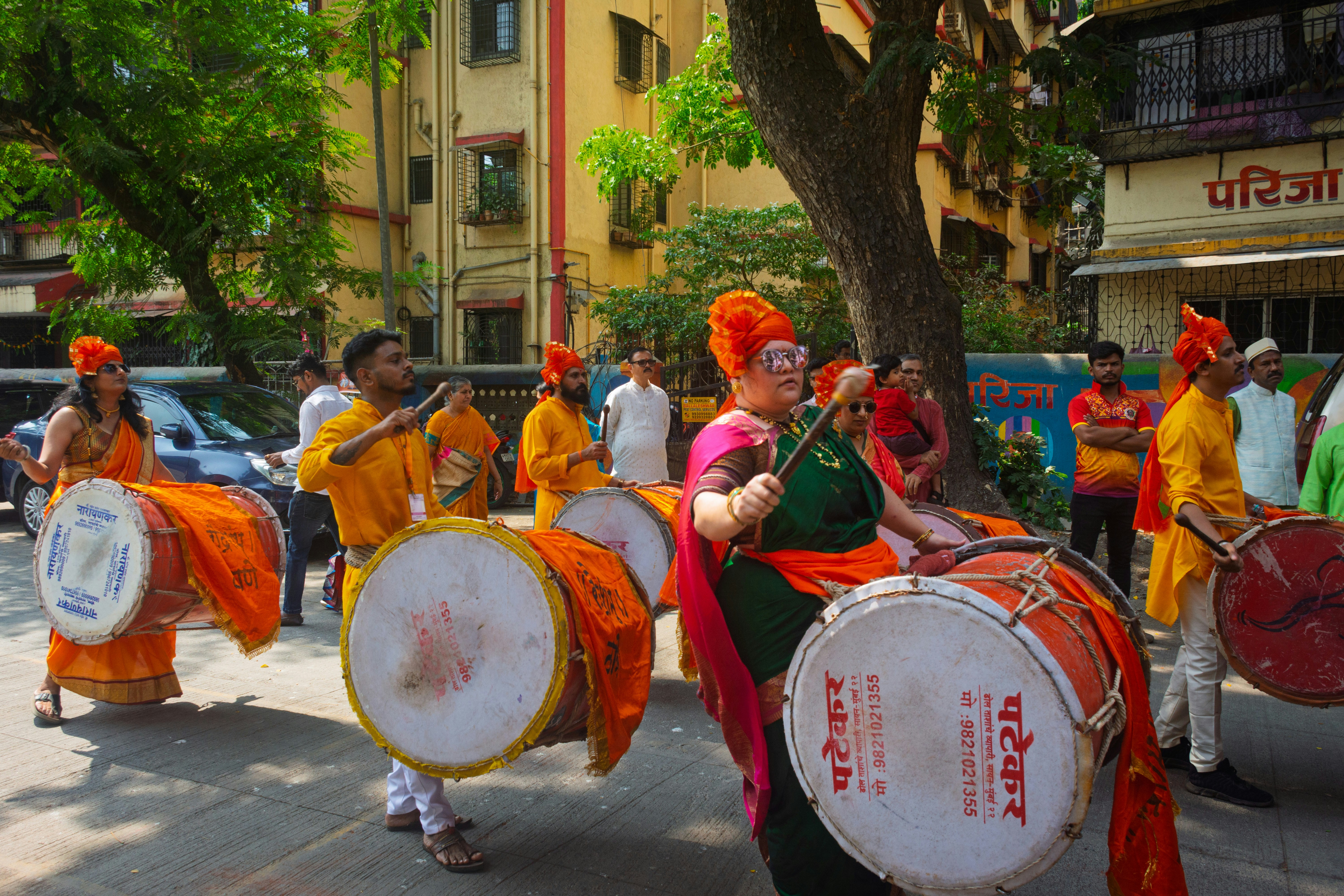 Drums in the Street: Colorful Parade Moves in Sunlit Alley