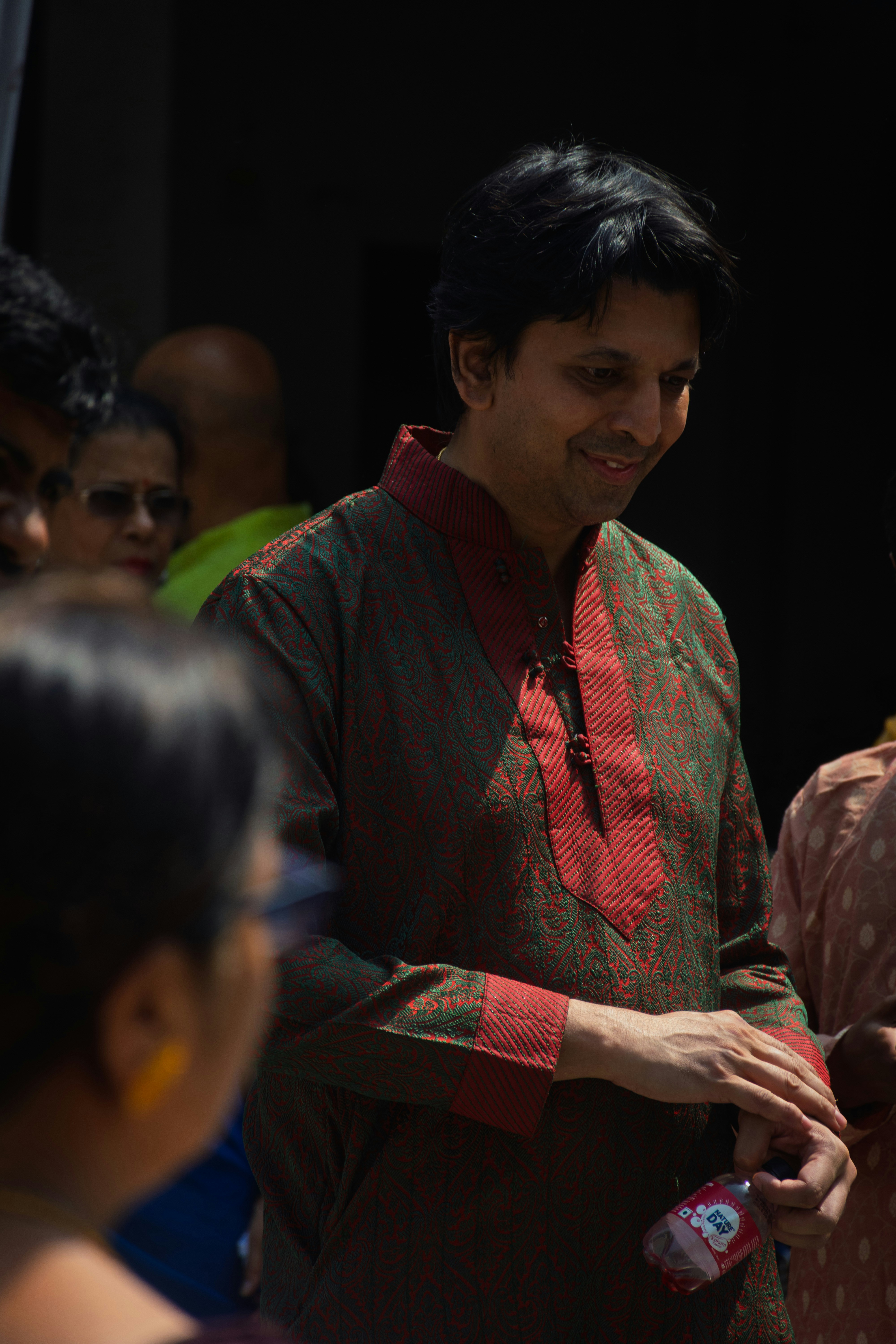 A Quiet Moment in a Traditional Gathering
