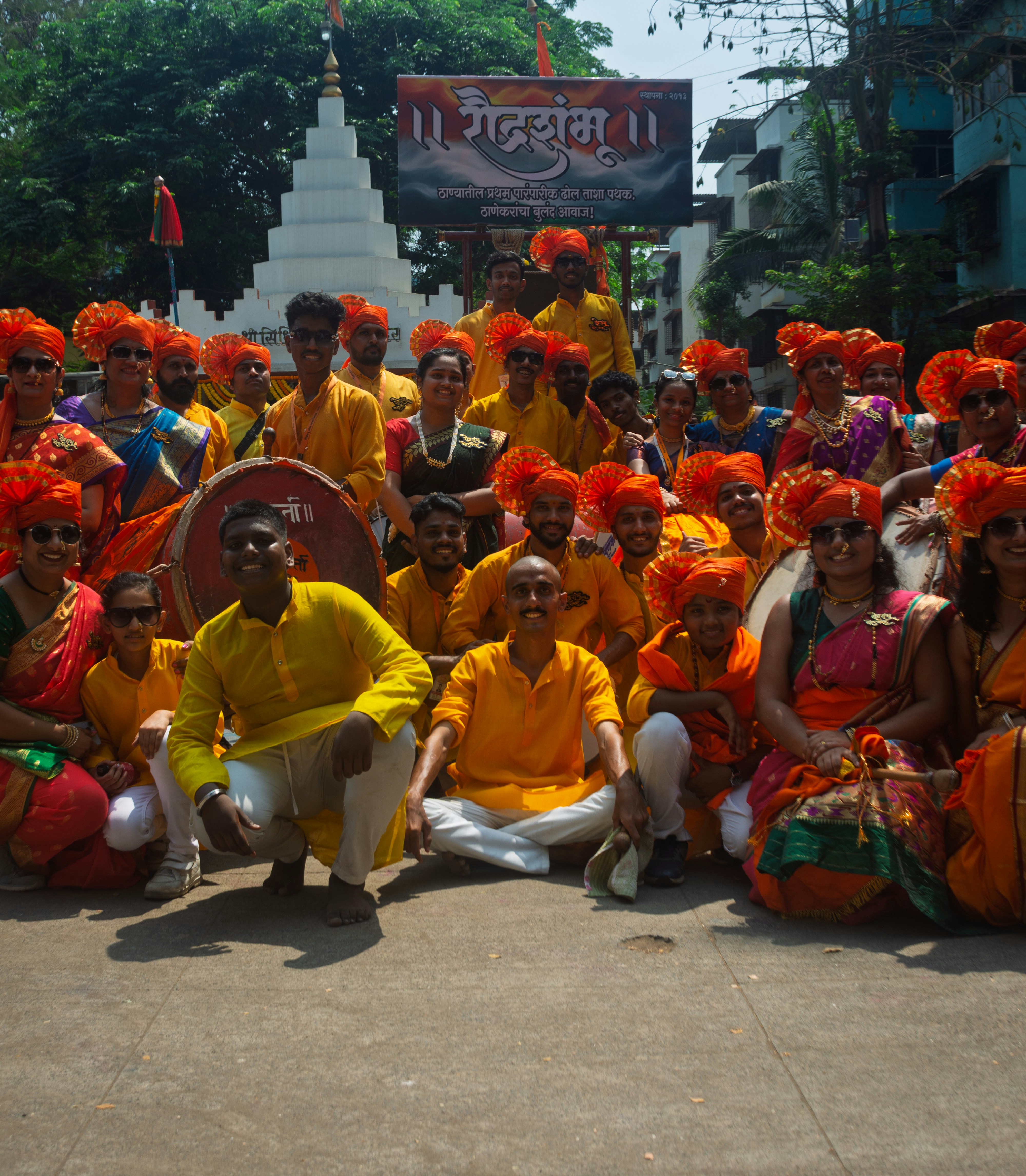 Vibrant Temple Gathering: A Sea of Orange and Gold