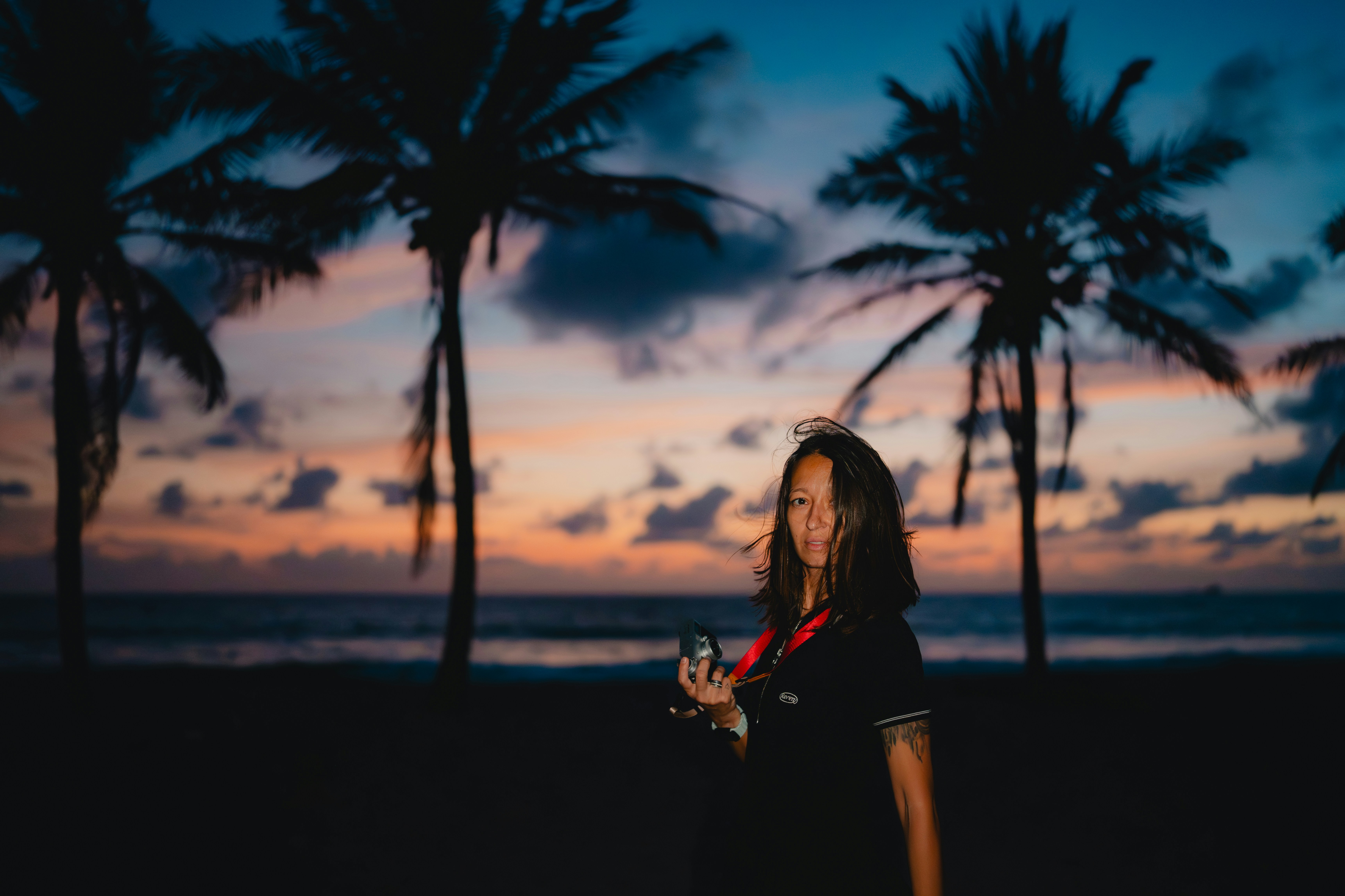 Silhouetted Portrait Beneath Tropical Dusk