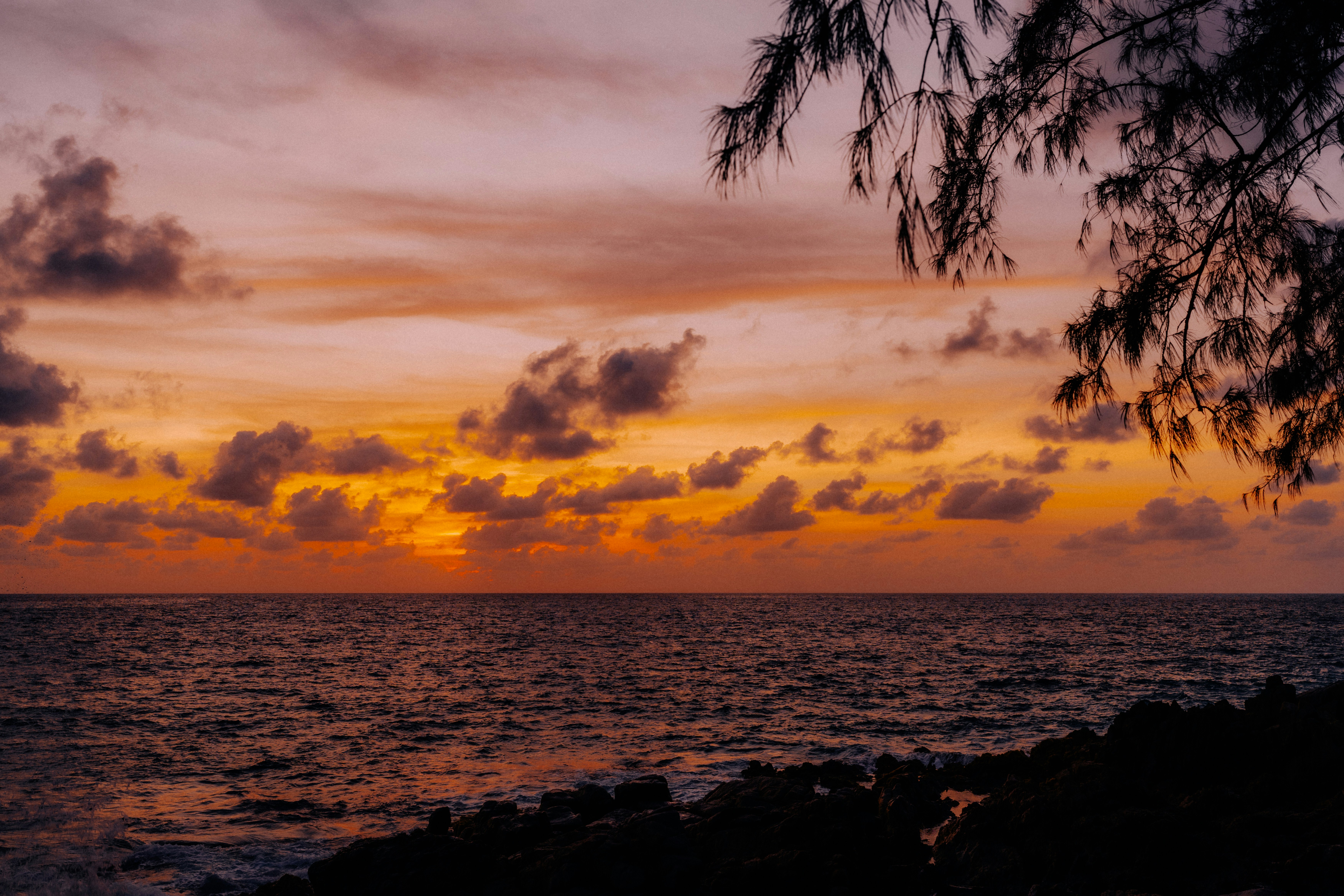 Twilight on the Edge: Sunset over Quiet Sea
