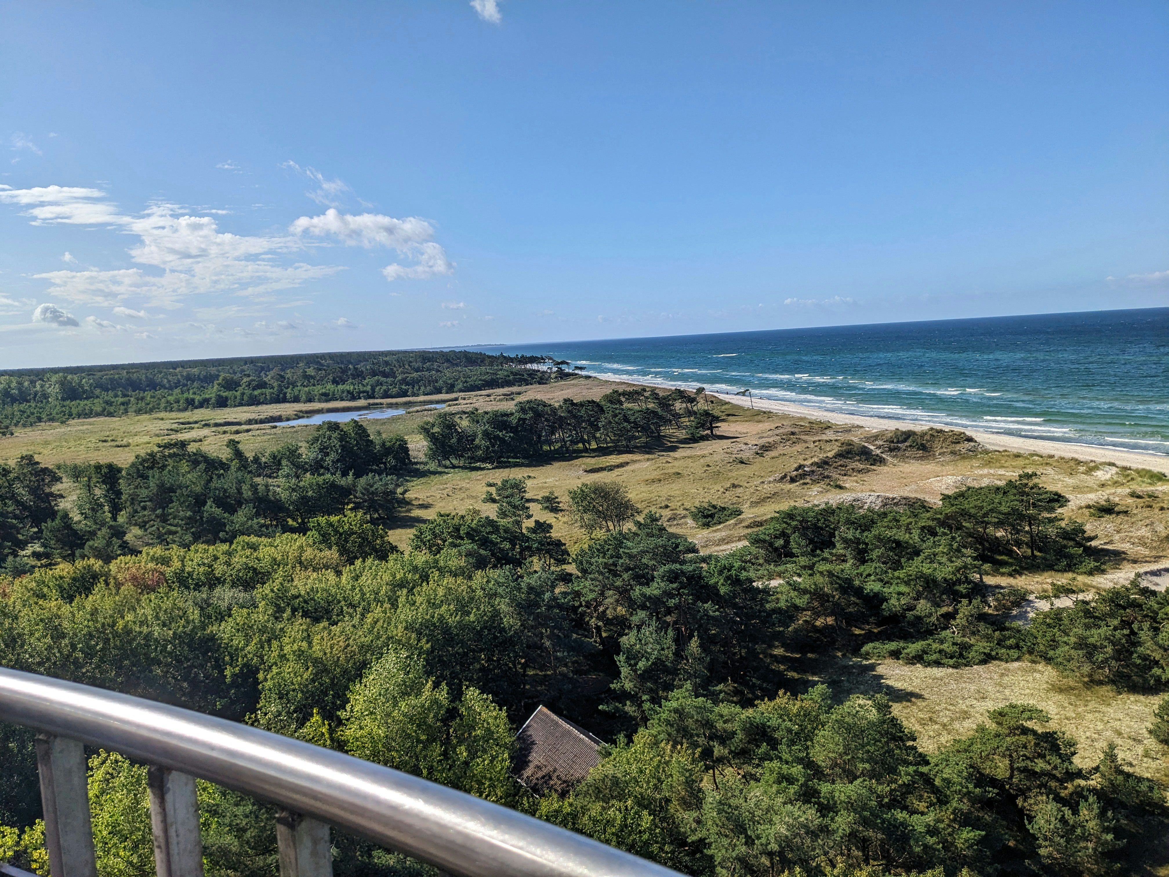 Coastal Dunes and Ocean Vista from a Sea‑Front Balcony