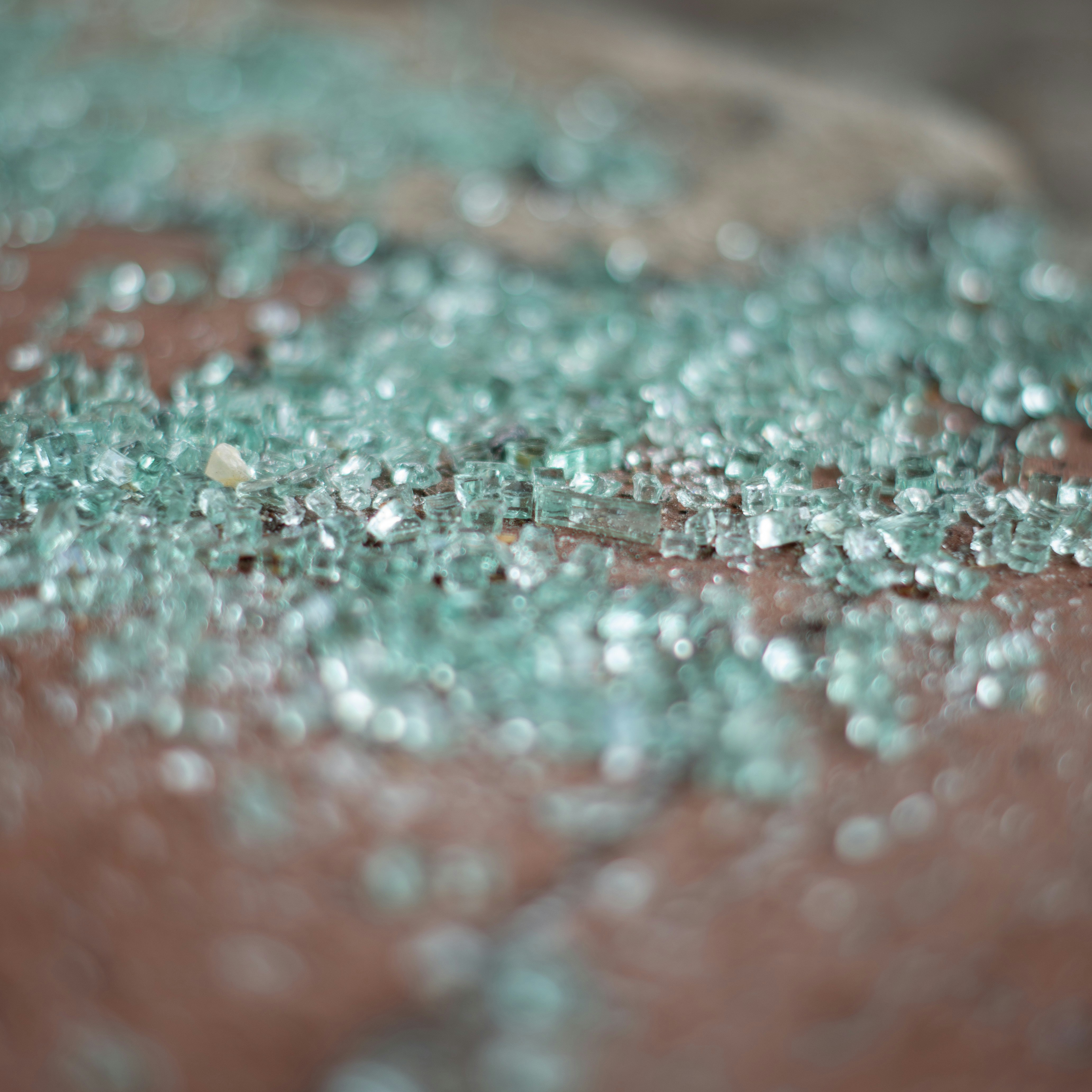 Shattered Turquoise Fragments on a Warm Surface