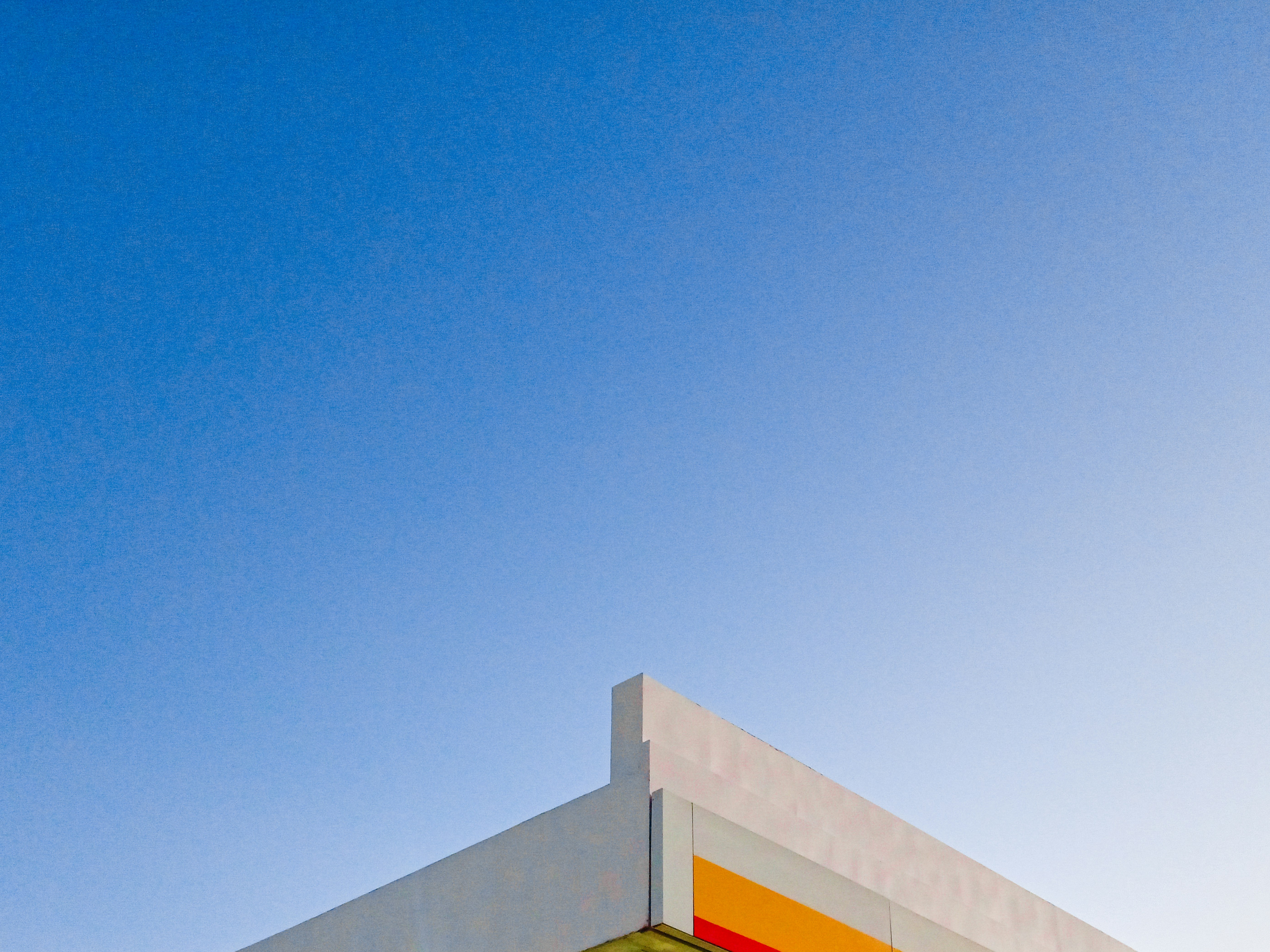 Corner of a Modern Roof Against a Clear Sky