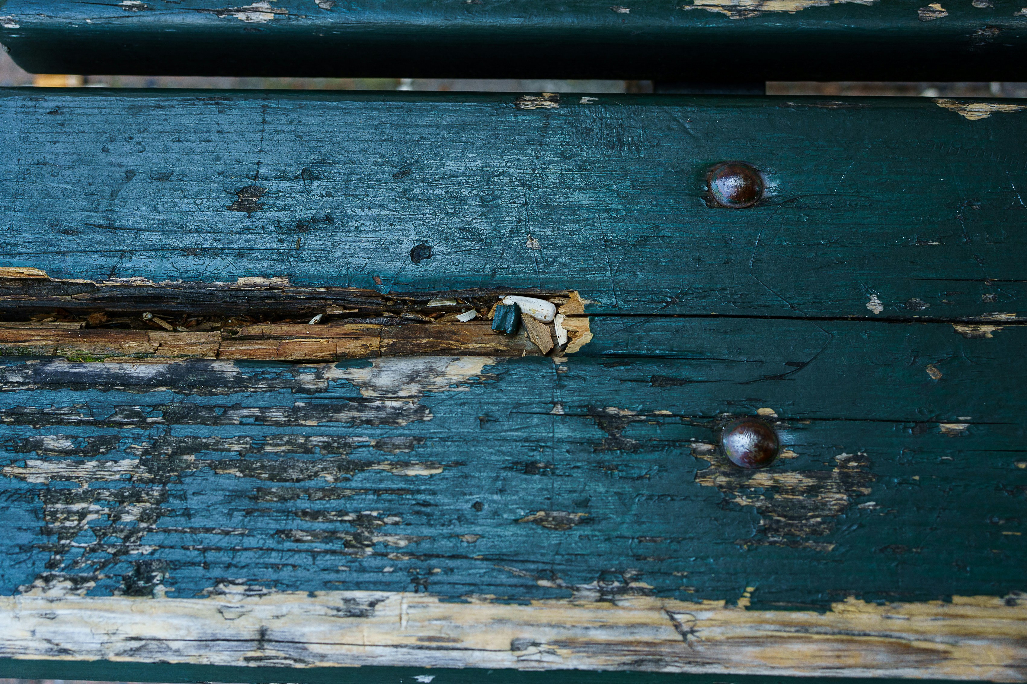 Weathered Blue Planks: Frayed Paint and Rusted Nails
