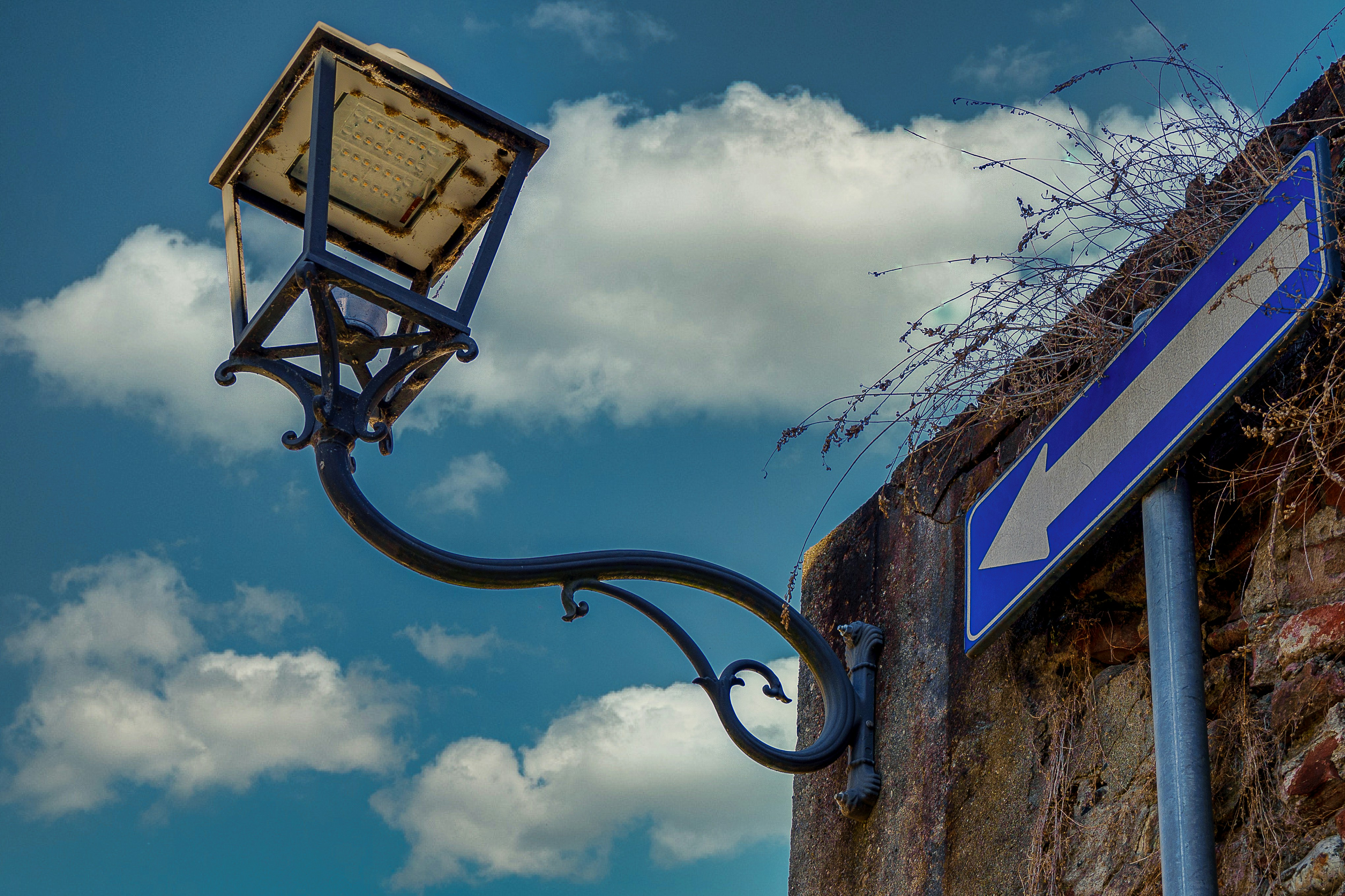 Curved Lantern Ember: A Vintage Lamp Reaches Toward the Sky