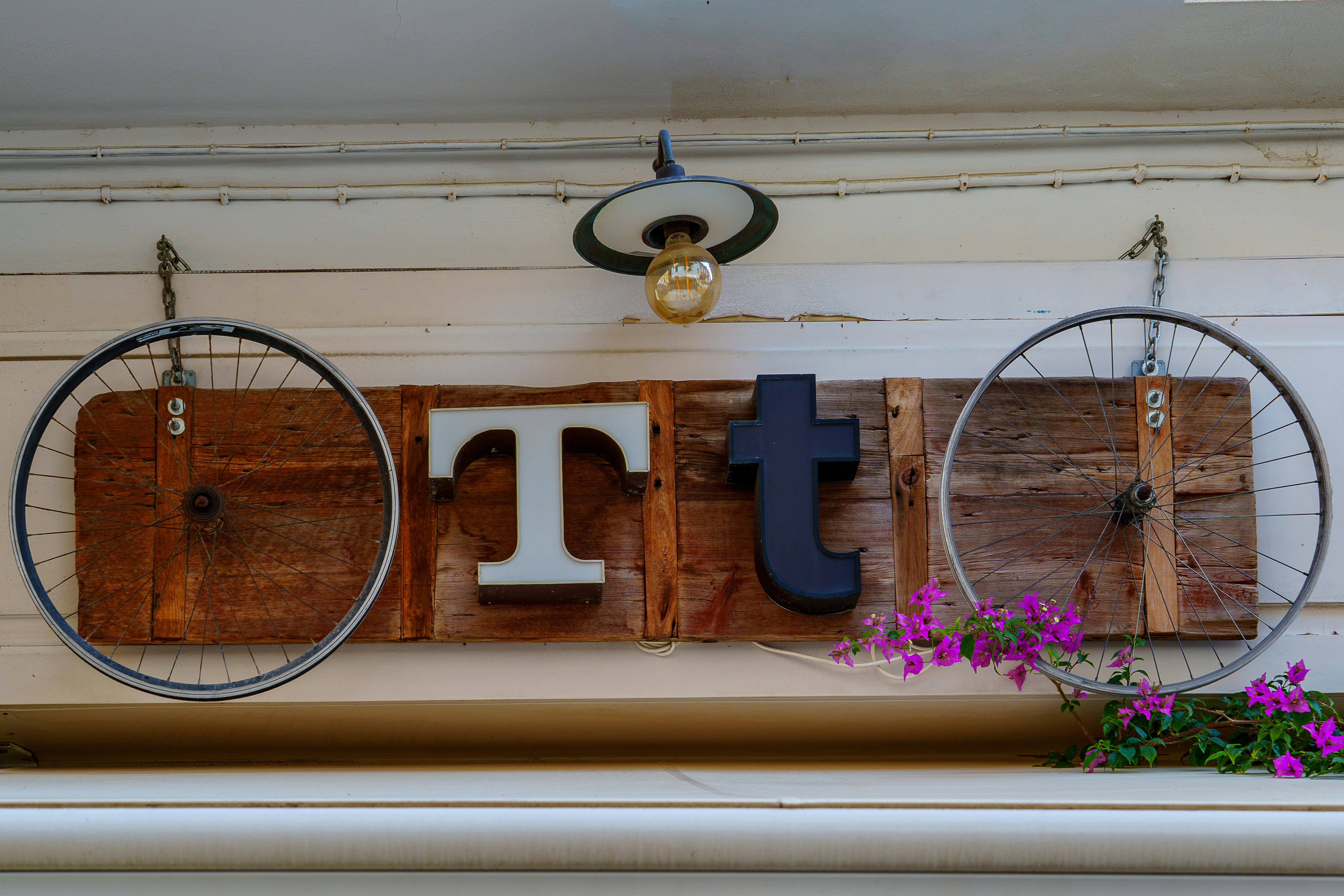 Rustic Signage in Bloom: A Tiny Café Portrait