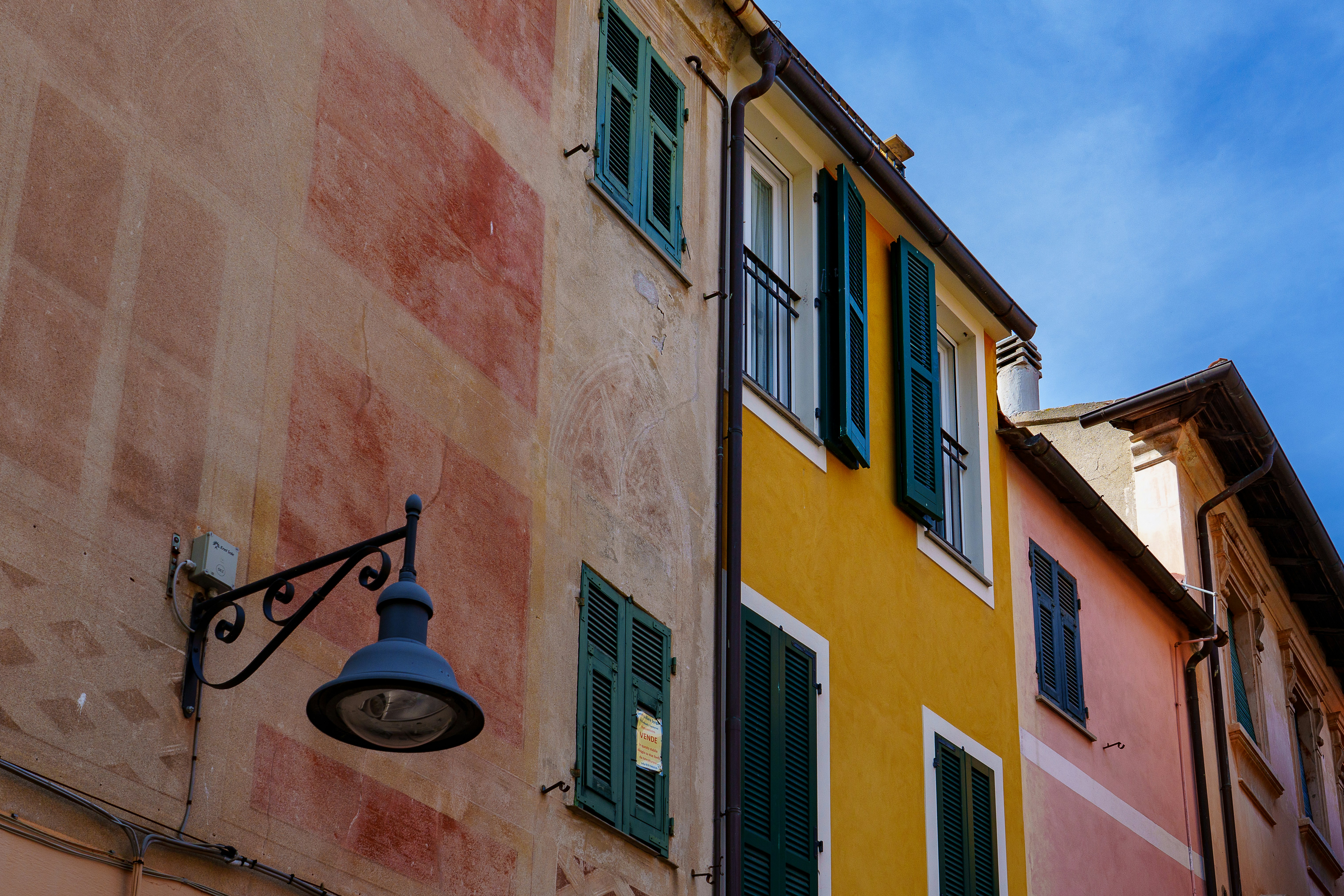Colorful Facade: A Stairway of Sunlit Windows