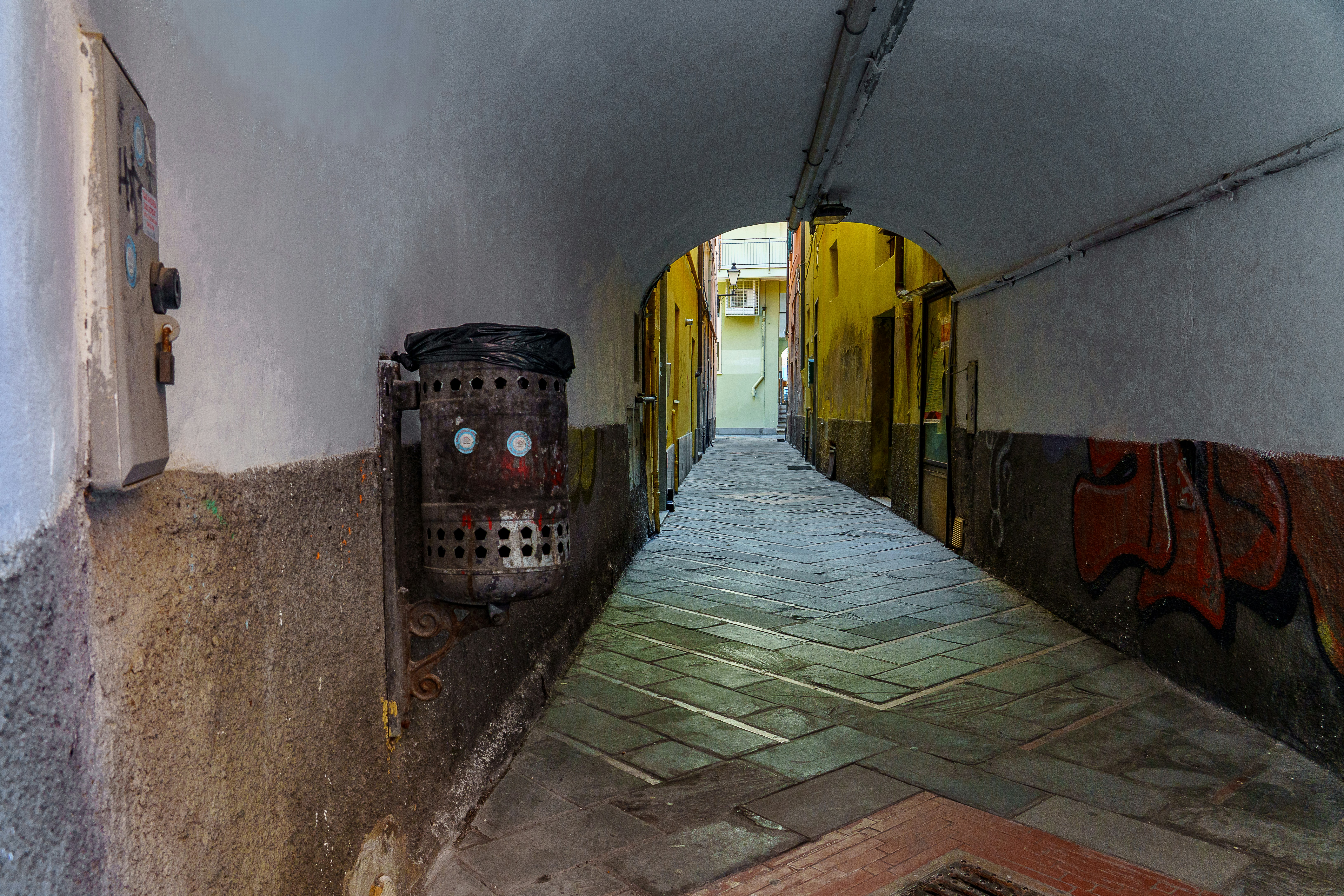 Narrow Arc: A Sunlit Passageway Through the Urban Tunnel