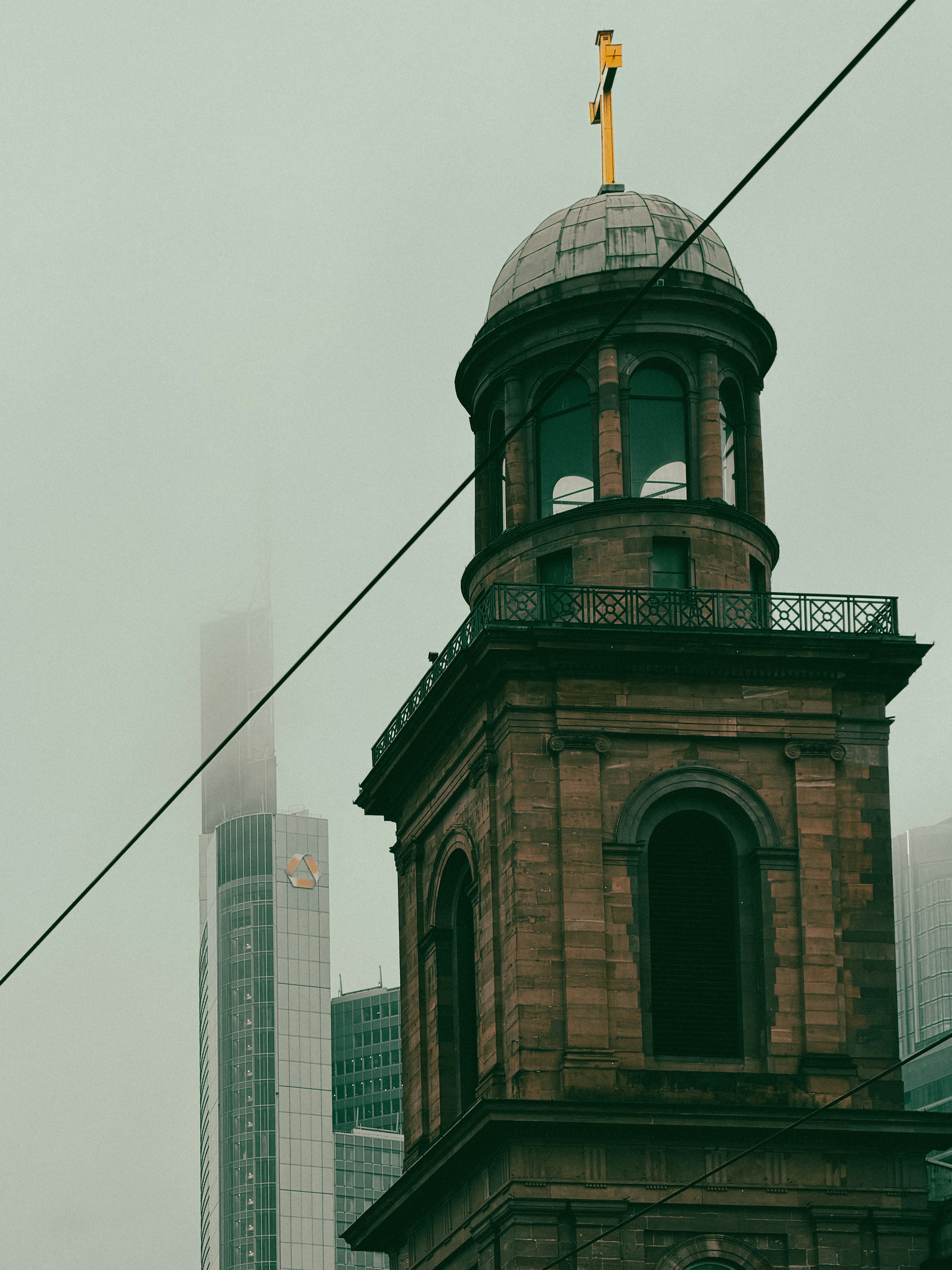 Legacy Belfry Against a Modern Skyline