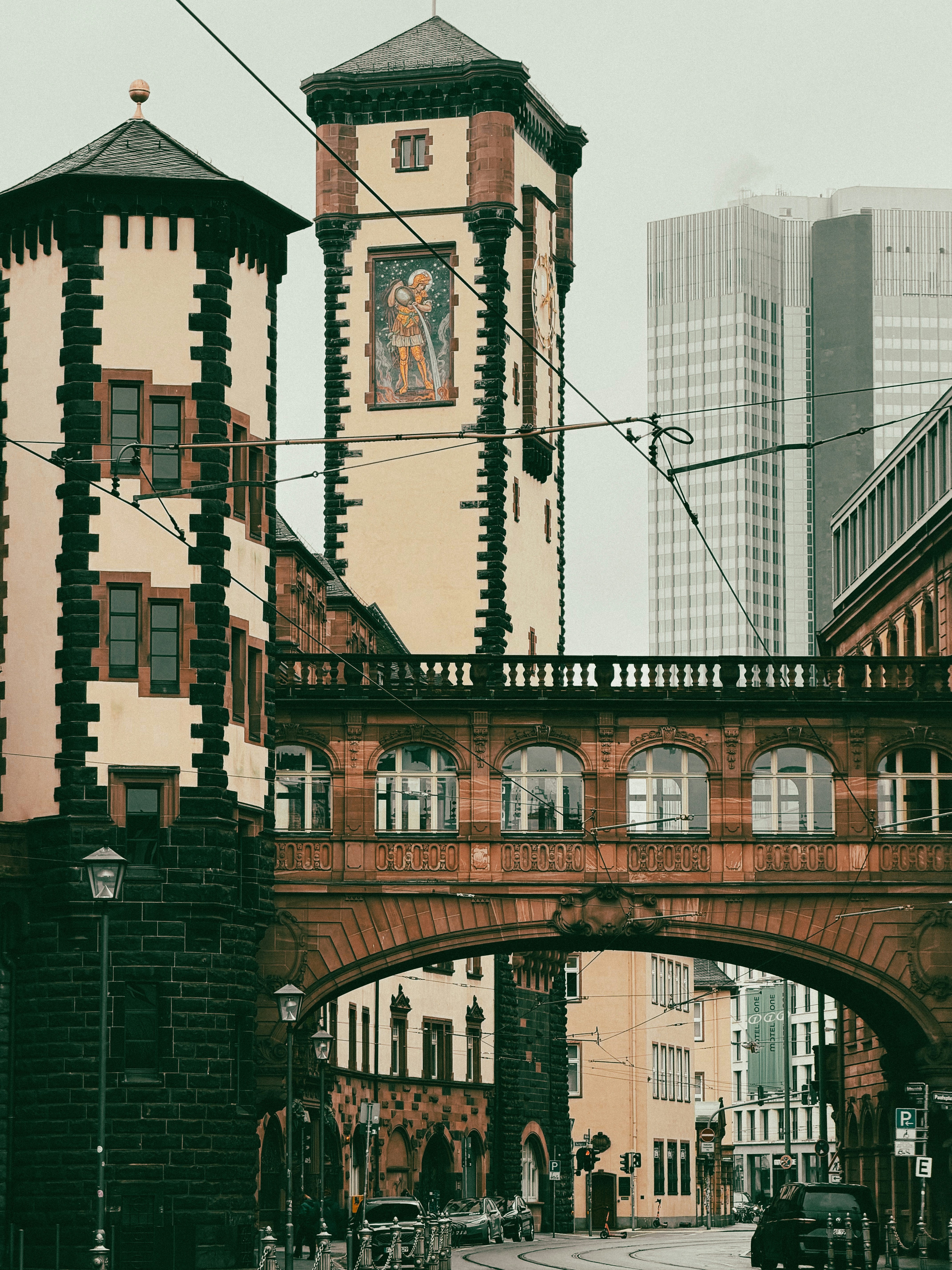 Brick-arched Portal Under a Towered Bridge in an Urban Canyon